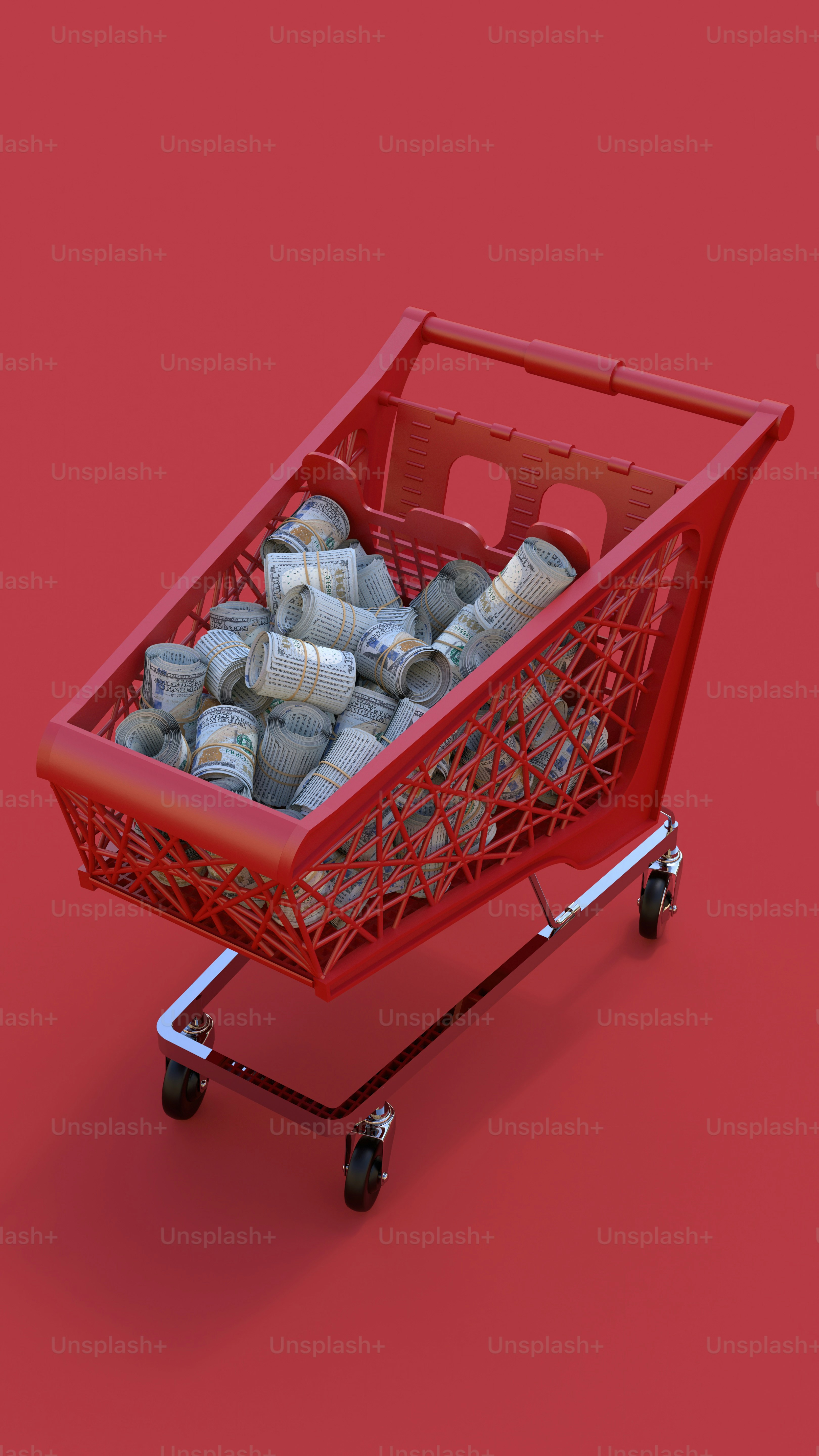 A shopping cart filled with silver objects on a pink background photo ...