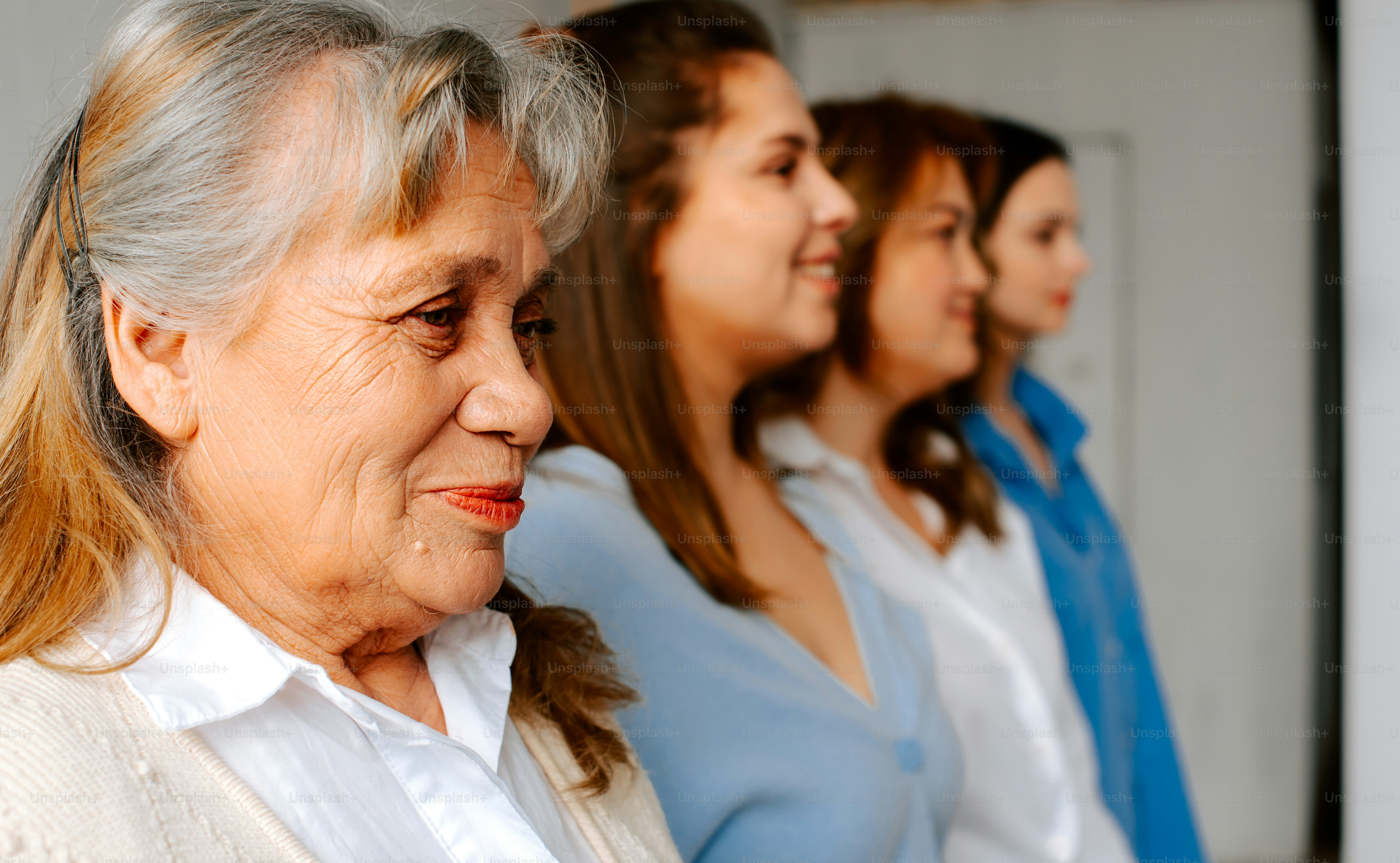 A group of women standing next to each other photo – Group Image on ...
