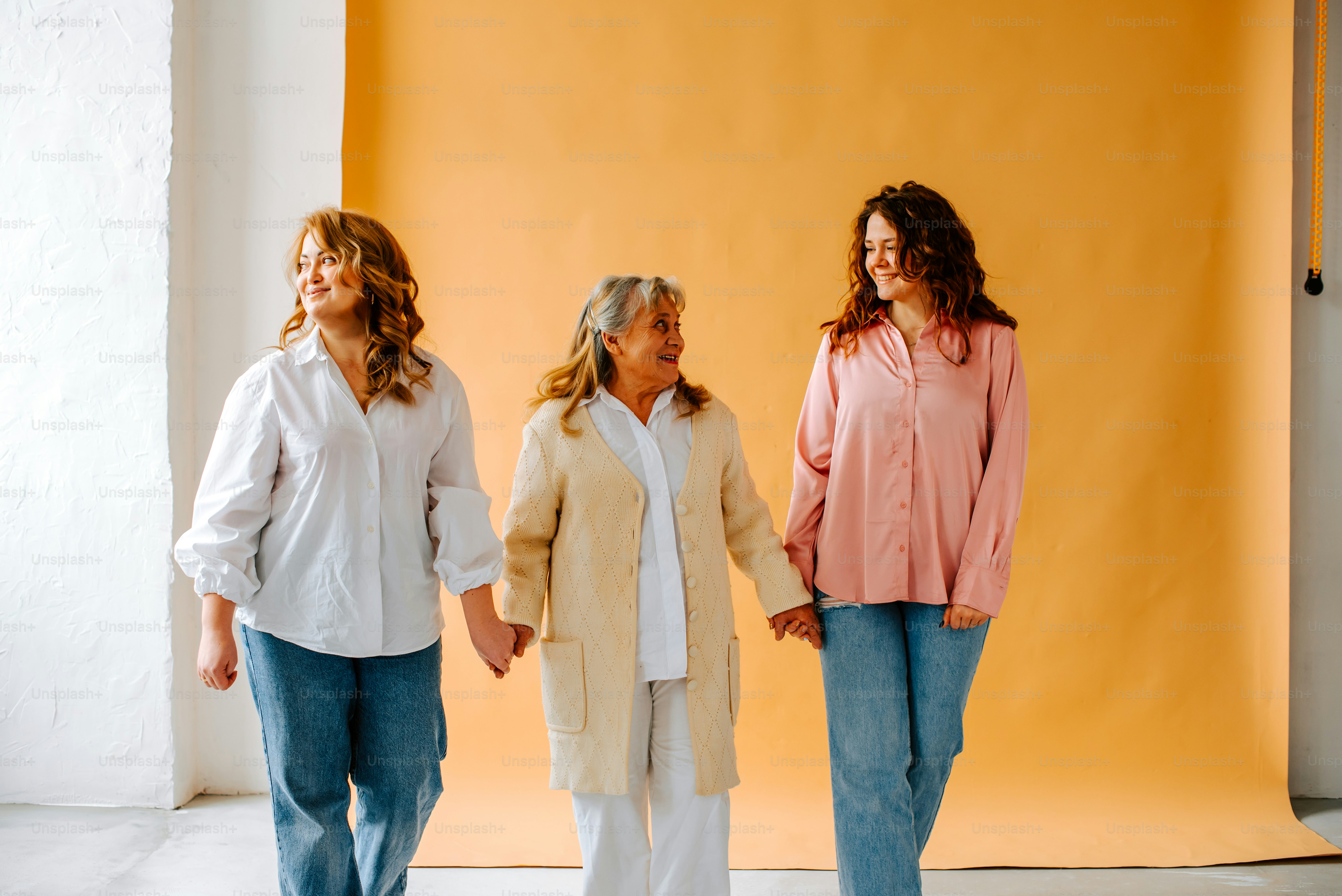 A group of three women standing next to each other photo – Female Image ...