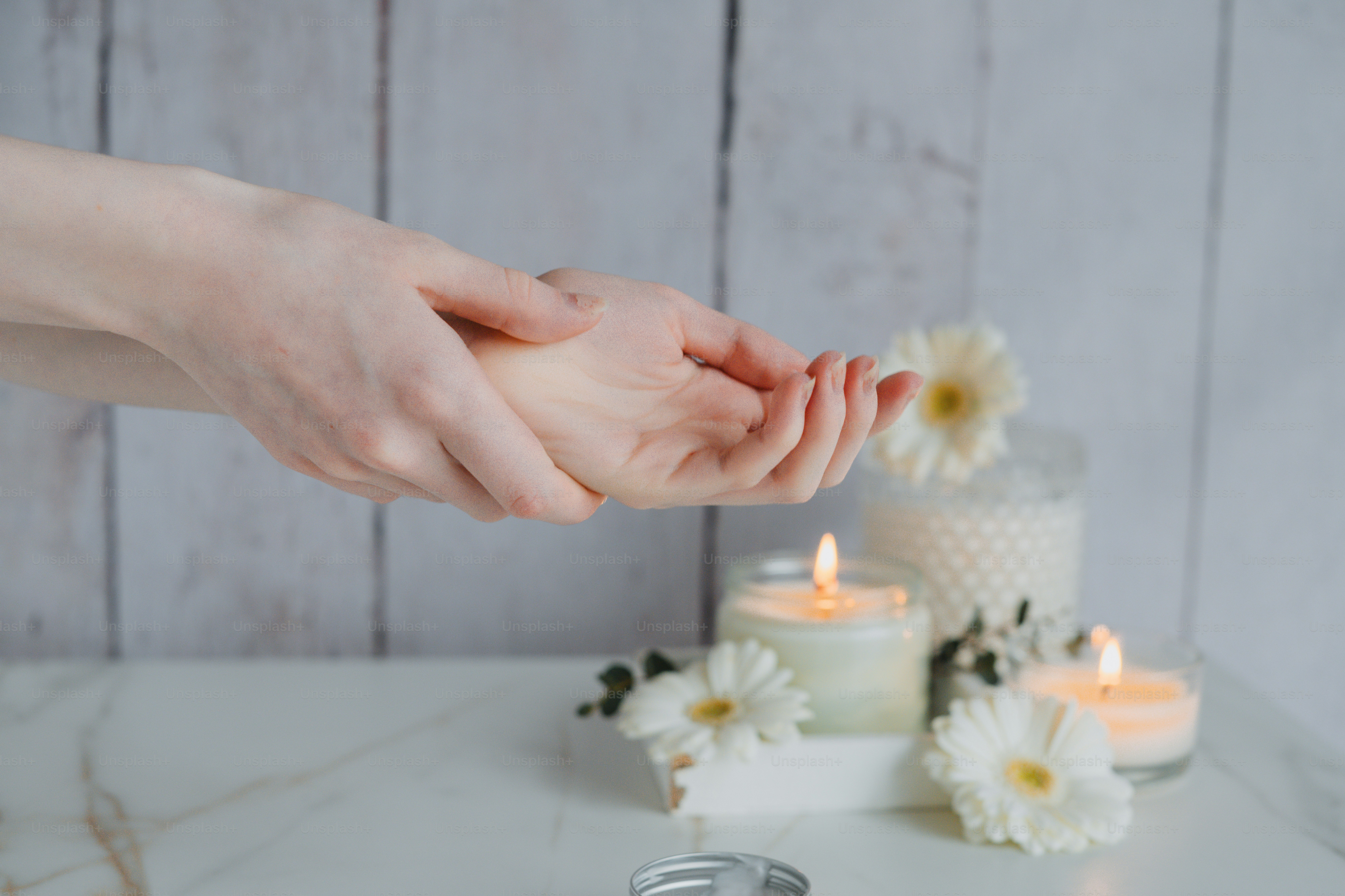 A person holding another persons hand over a cake photo – Caring Image ...