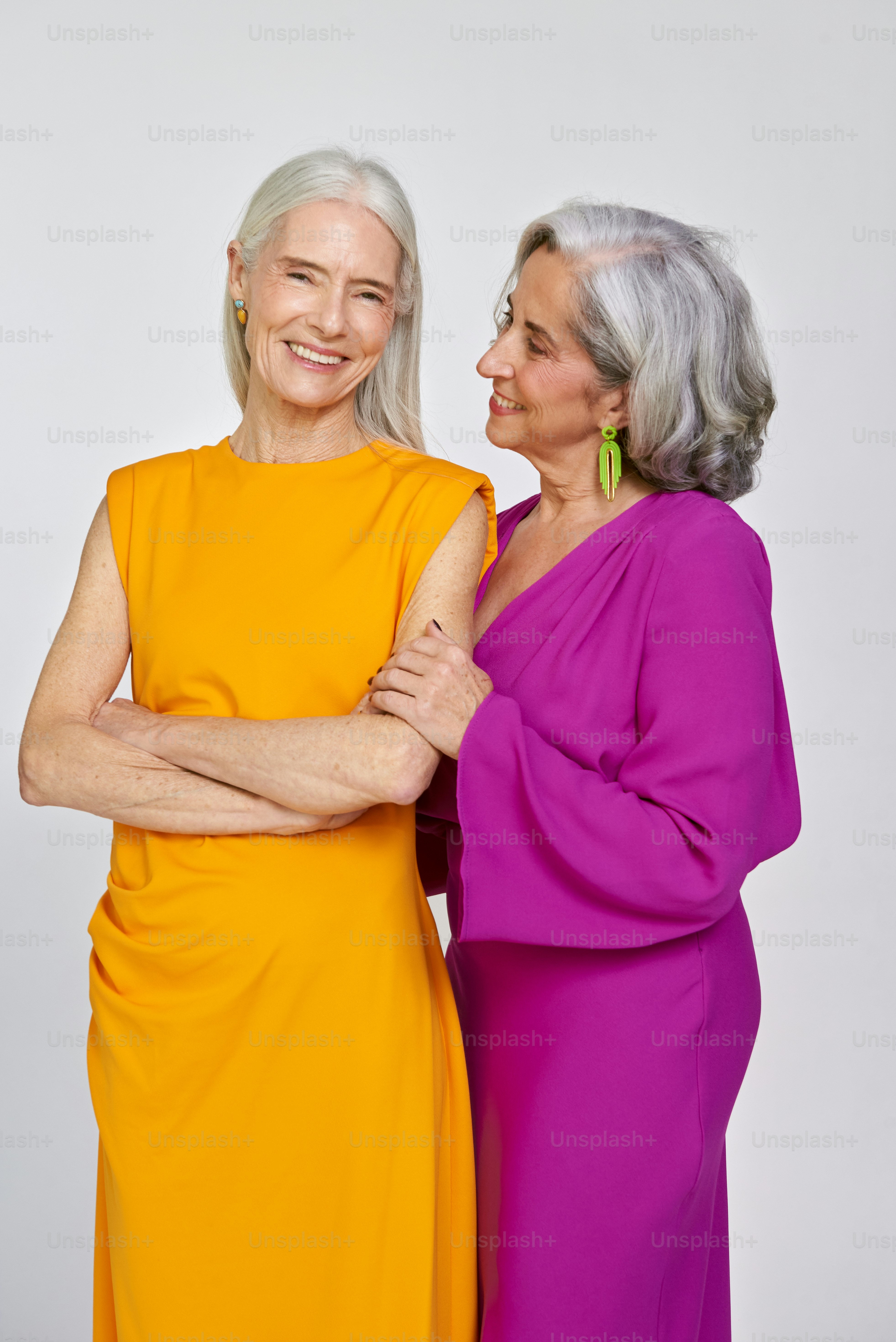 Two older women standing next to each other photo – Formal dress Image ...