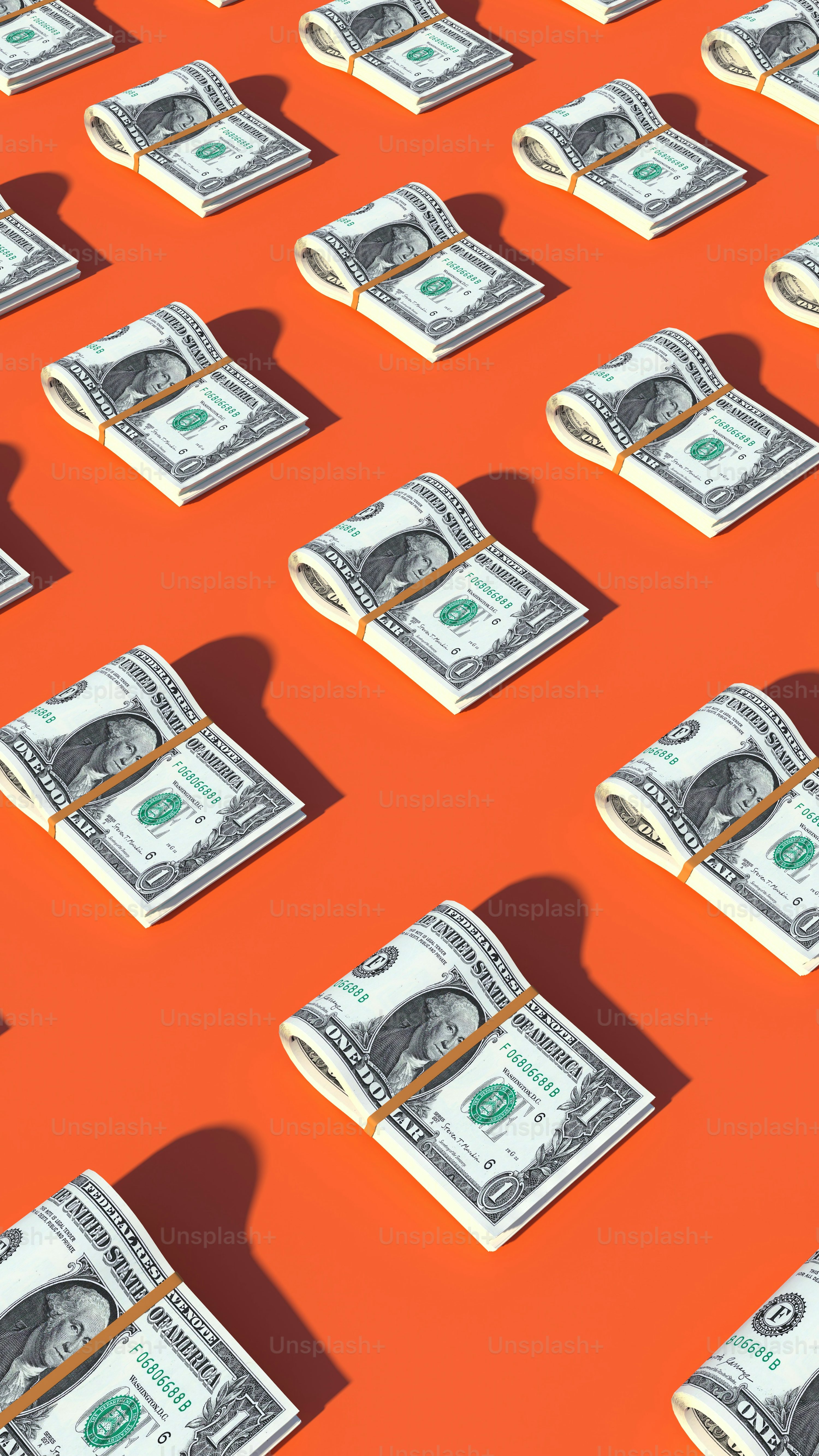 A bunch of money sitting on top of an orange surface photo – Money ... A bunch of money sitting on top of an orange surface photo – Money ...