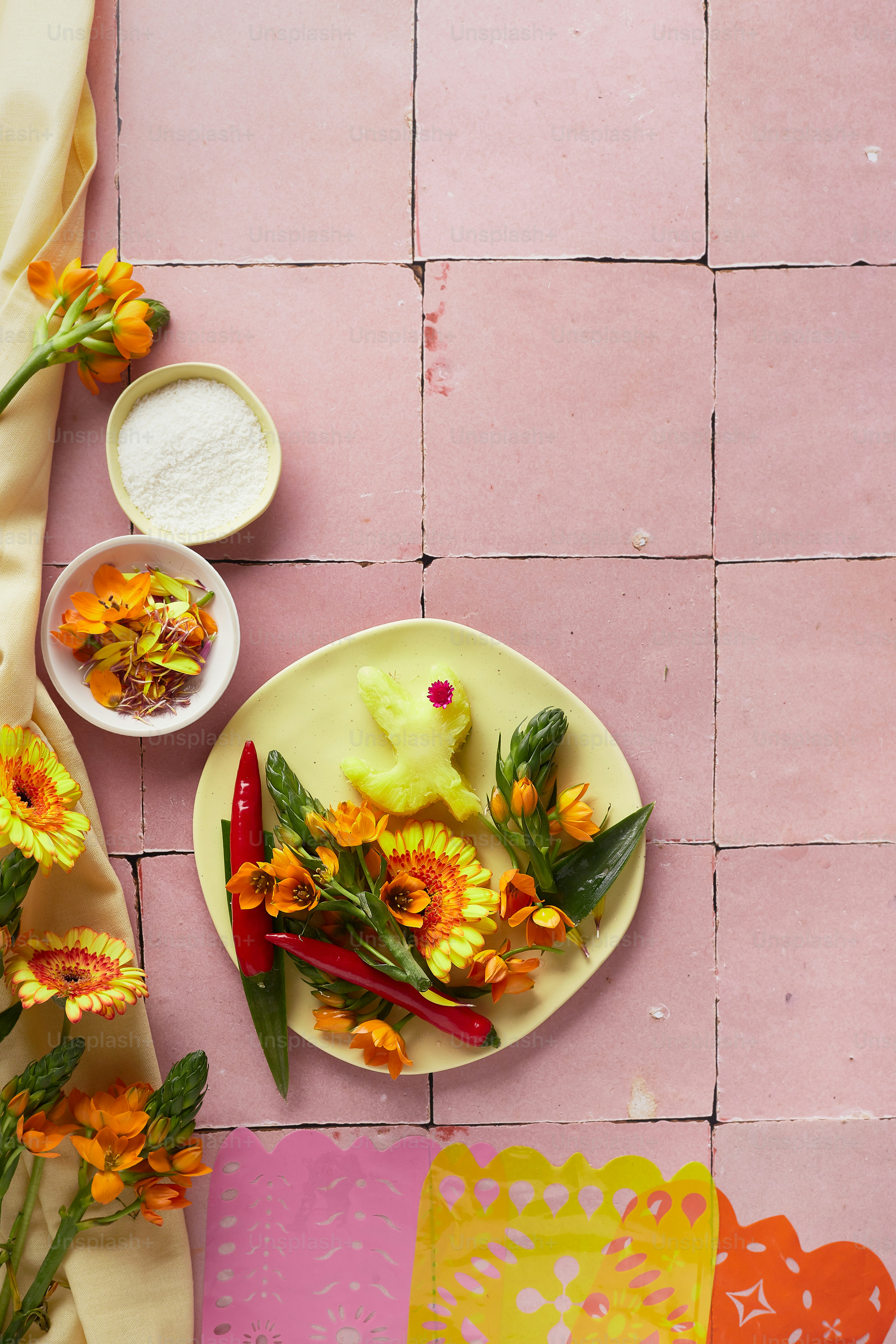 A plate of food on a pink tile floor photo – Flowers Image on Unsplash