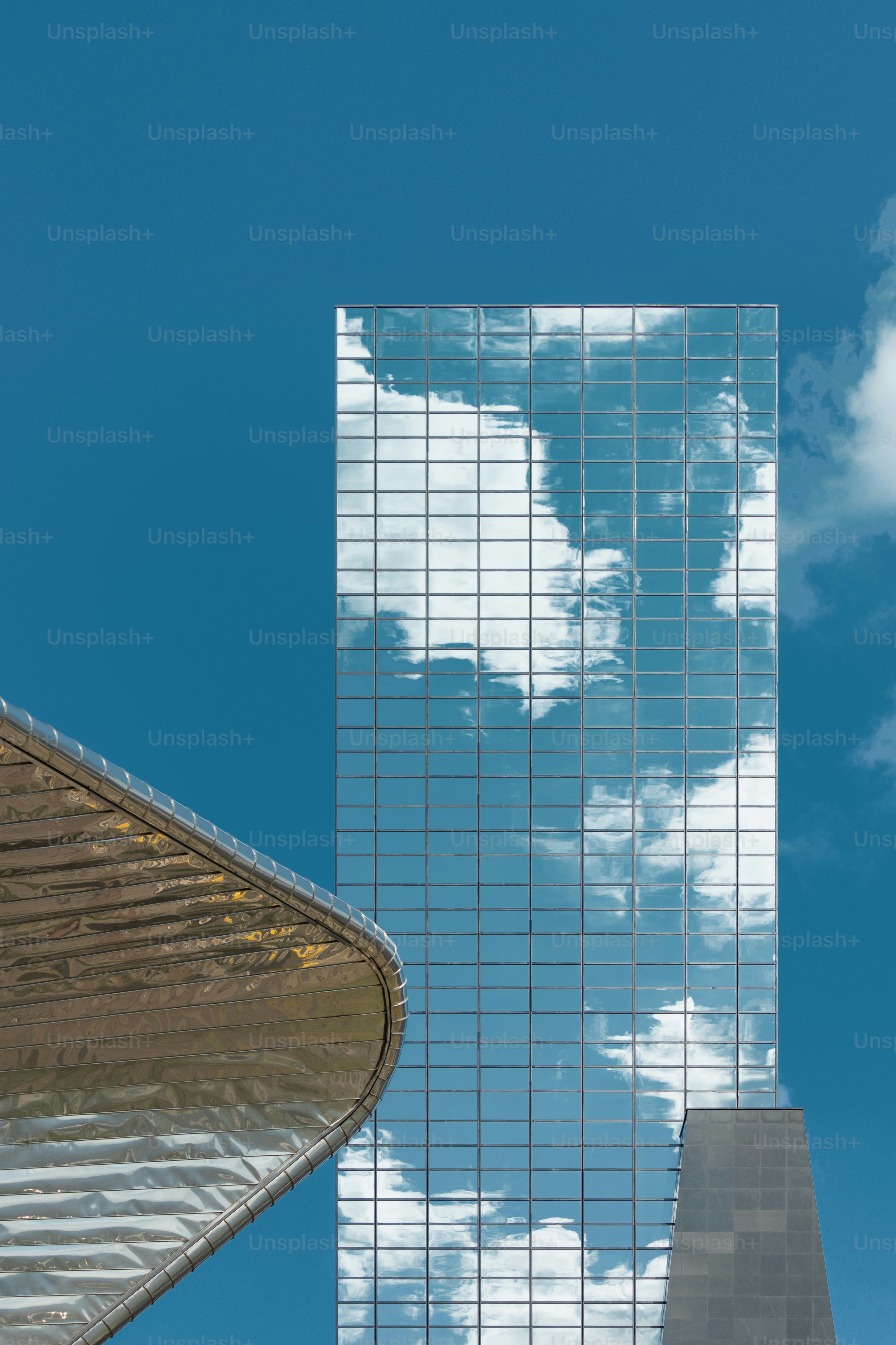 A very tall building next to a very tall building photo – Rotterdam ...