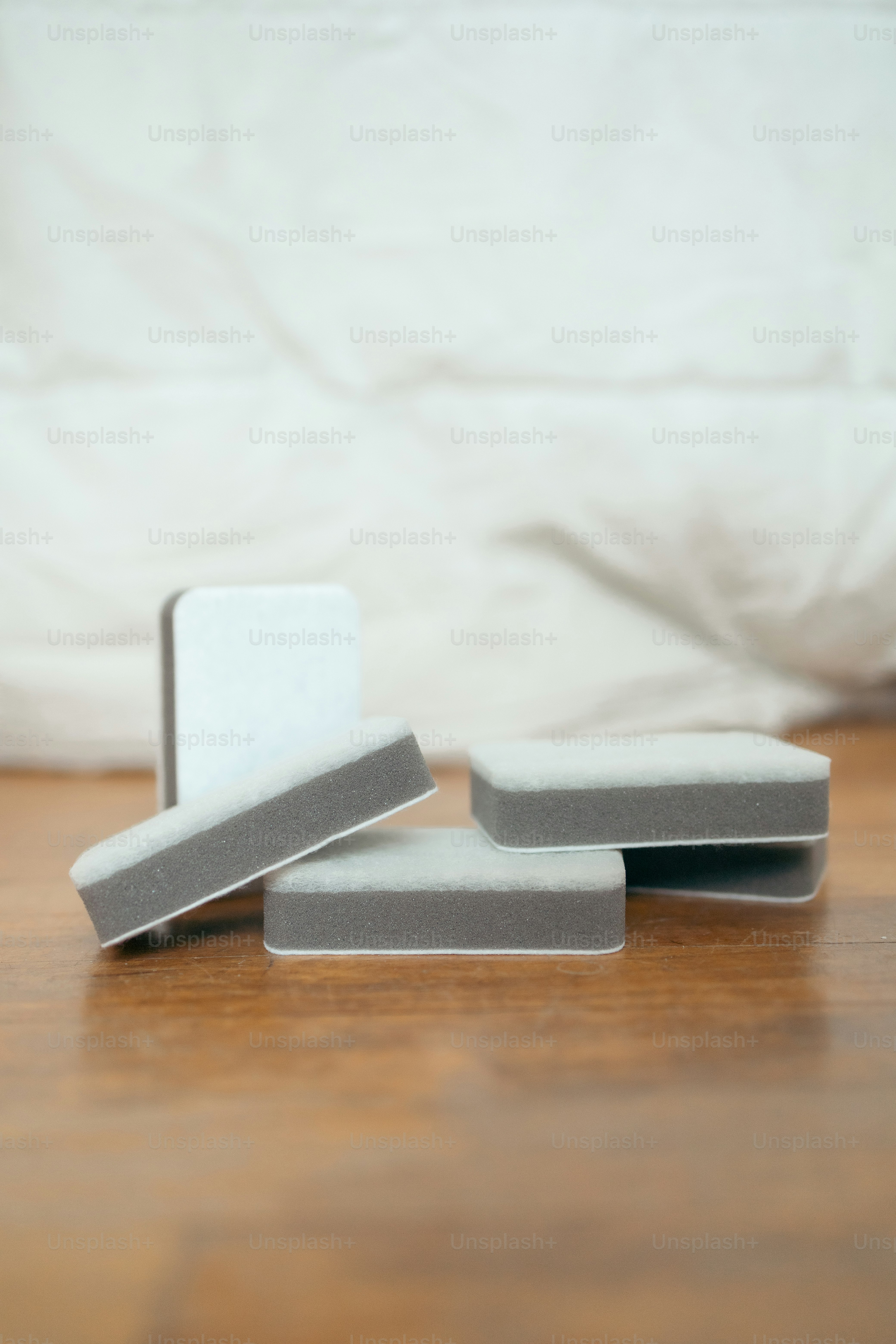 A couple of pieces of white foam sitting on top of a wooden table photo ...