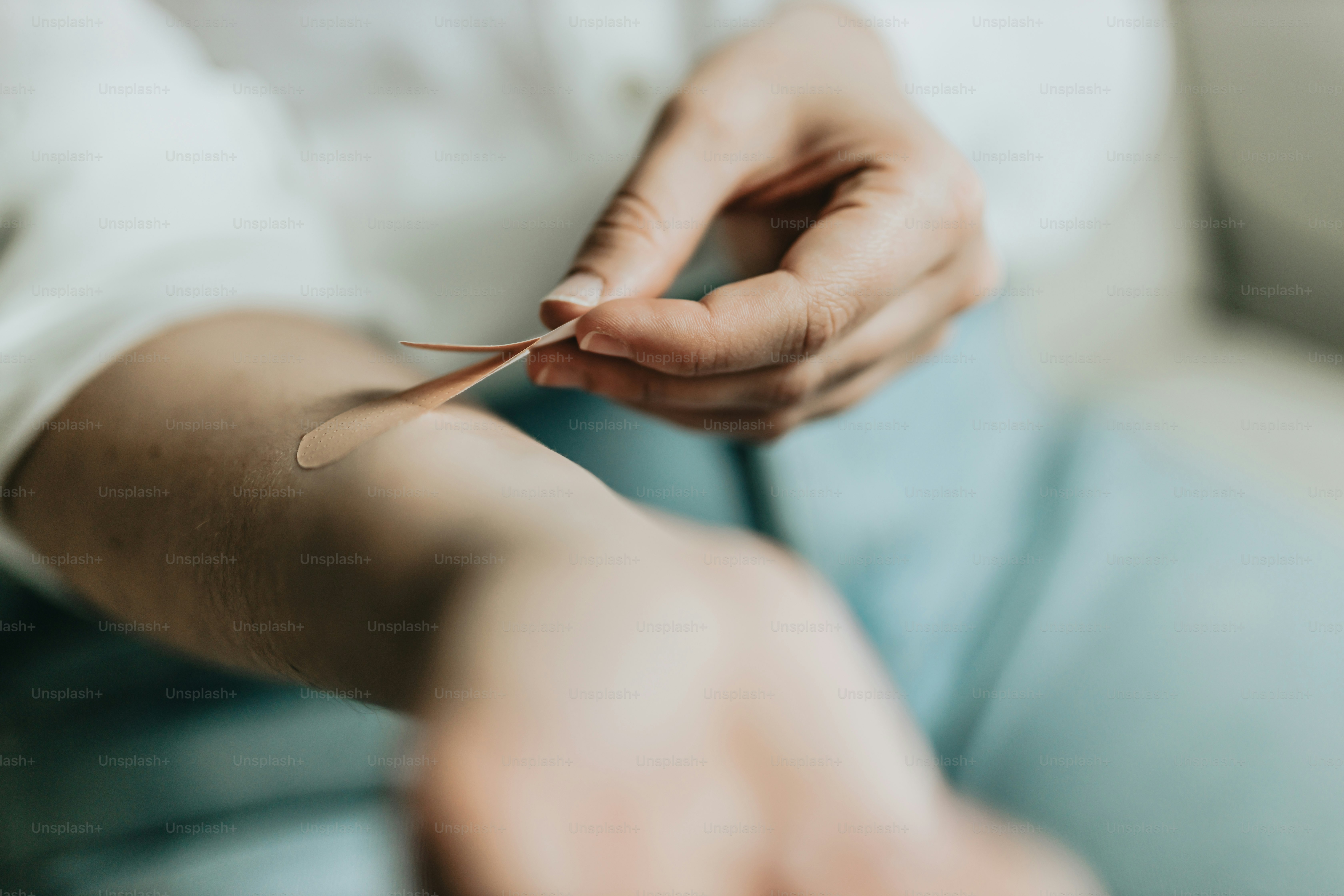 A person holding a pair of scissors in their hands photo – Wound Image ...