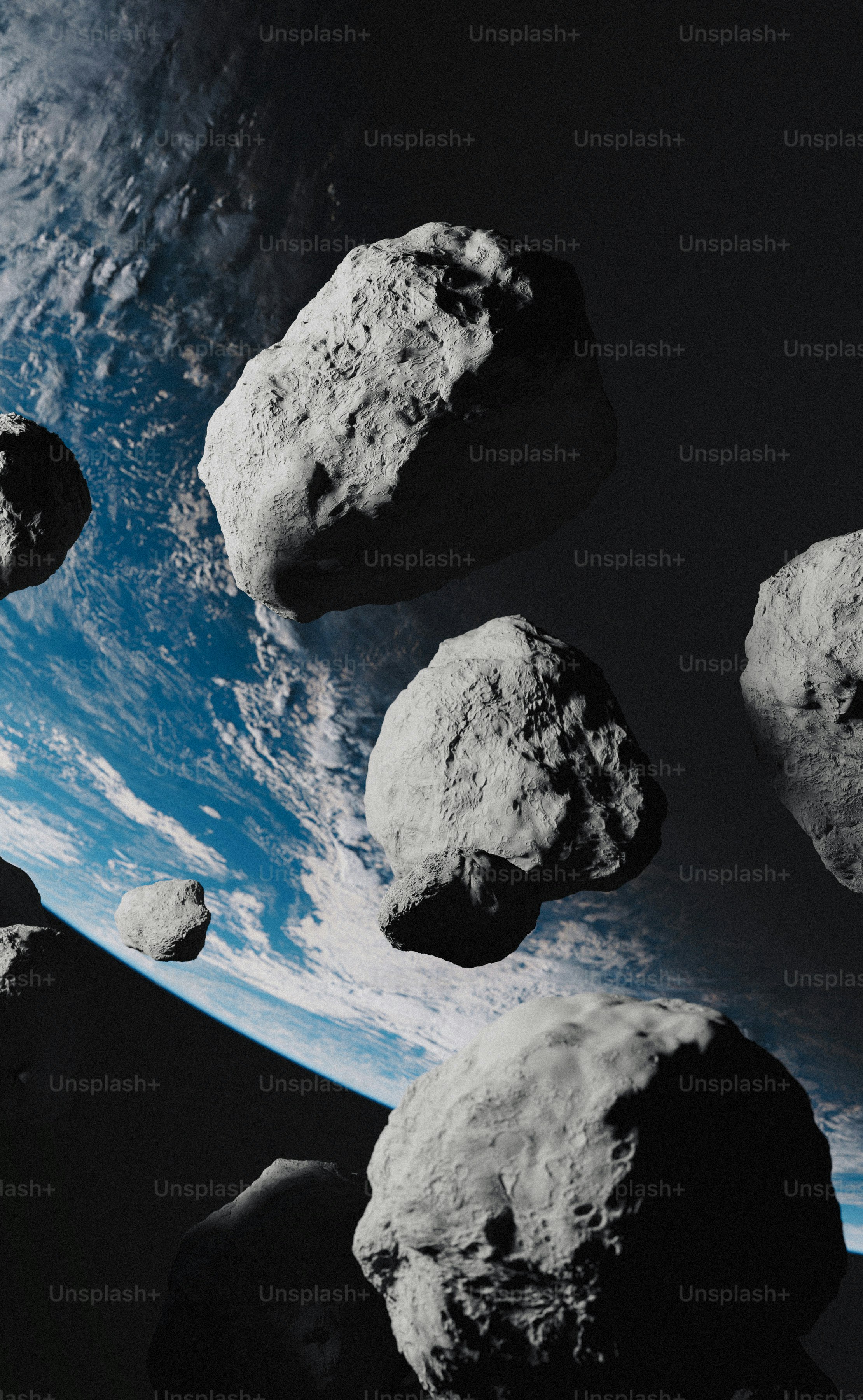 A group of rocks flying through the air photo – Outer space Image on ...