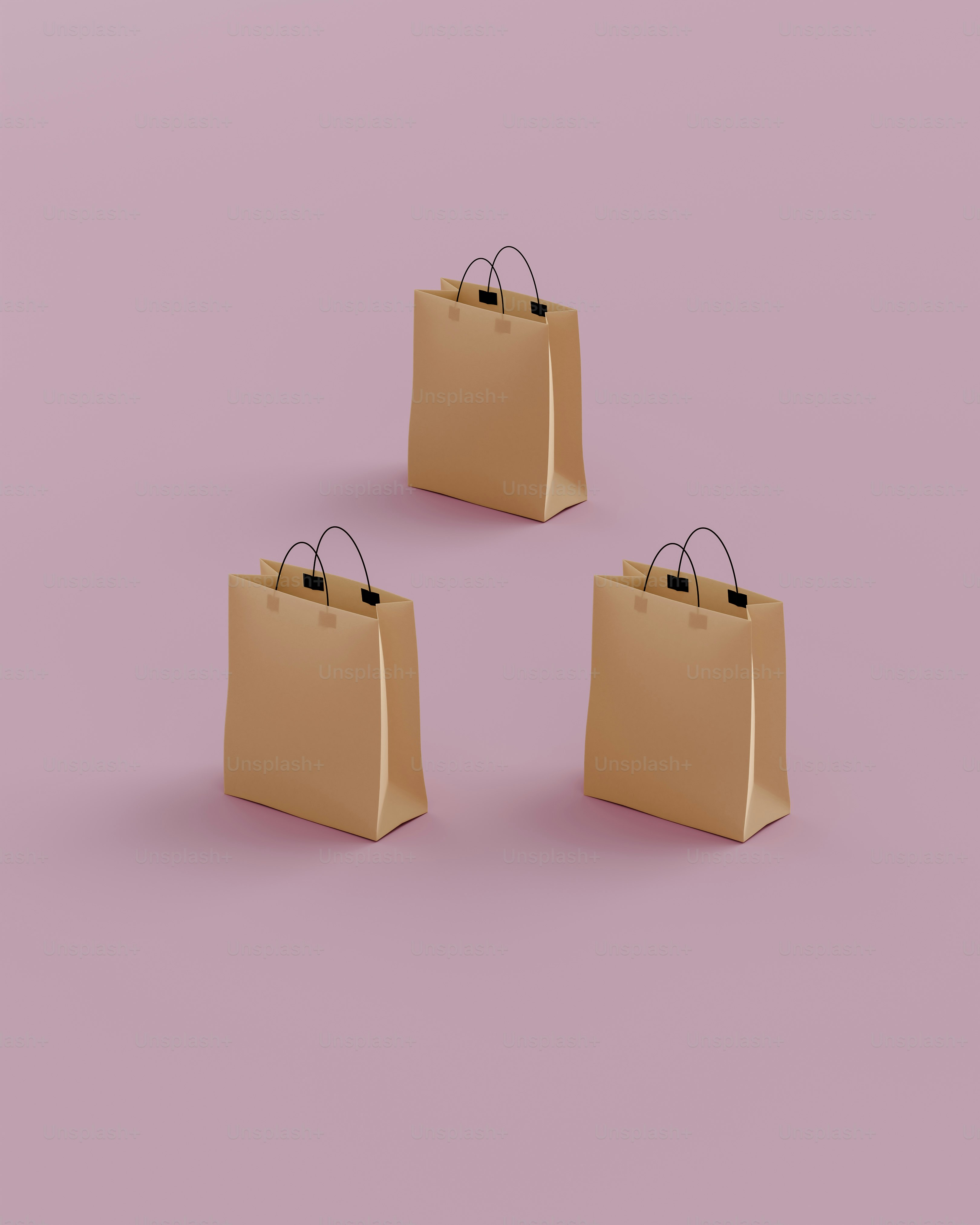 Three brown shopping bags on a pink background photo – Paper bag Image ...