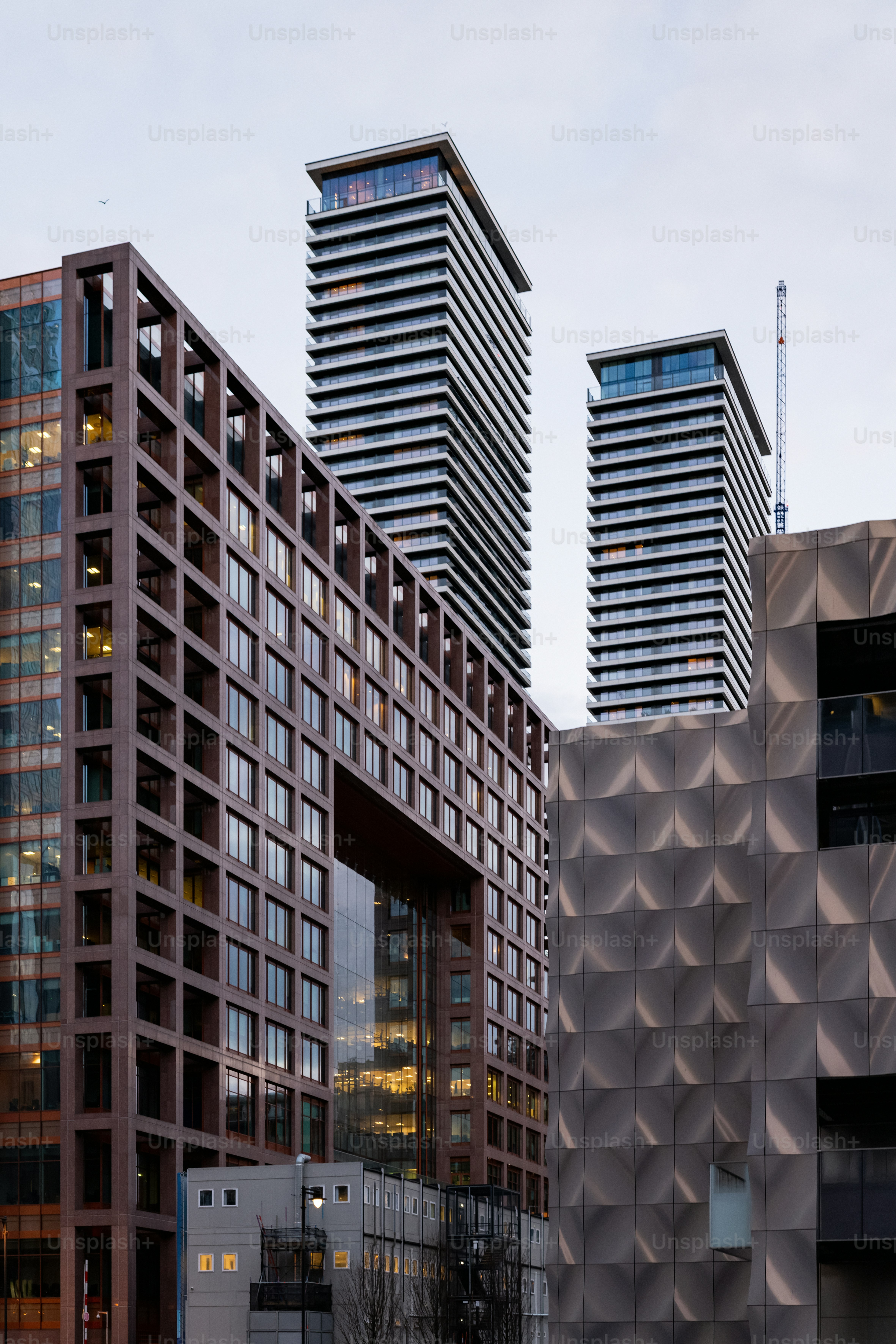 A group of tall buildings next to each other photo – Building Image on ...