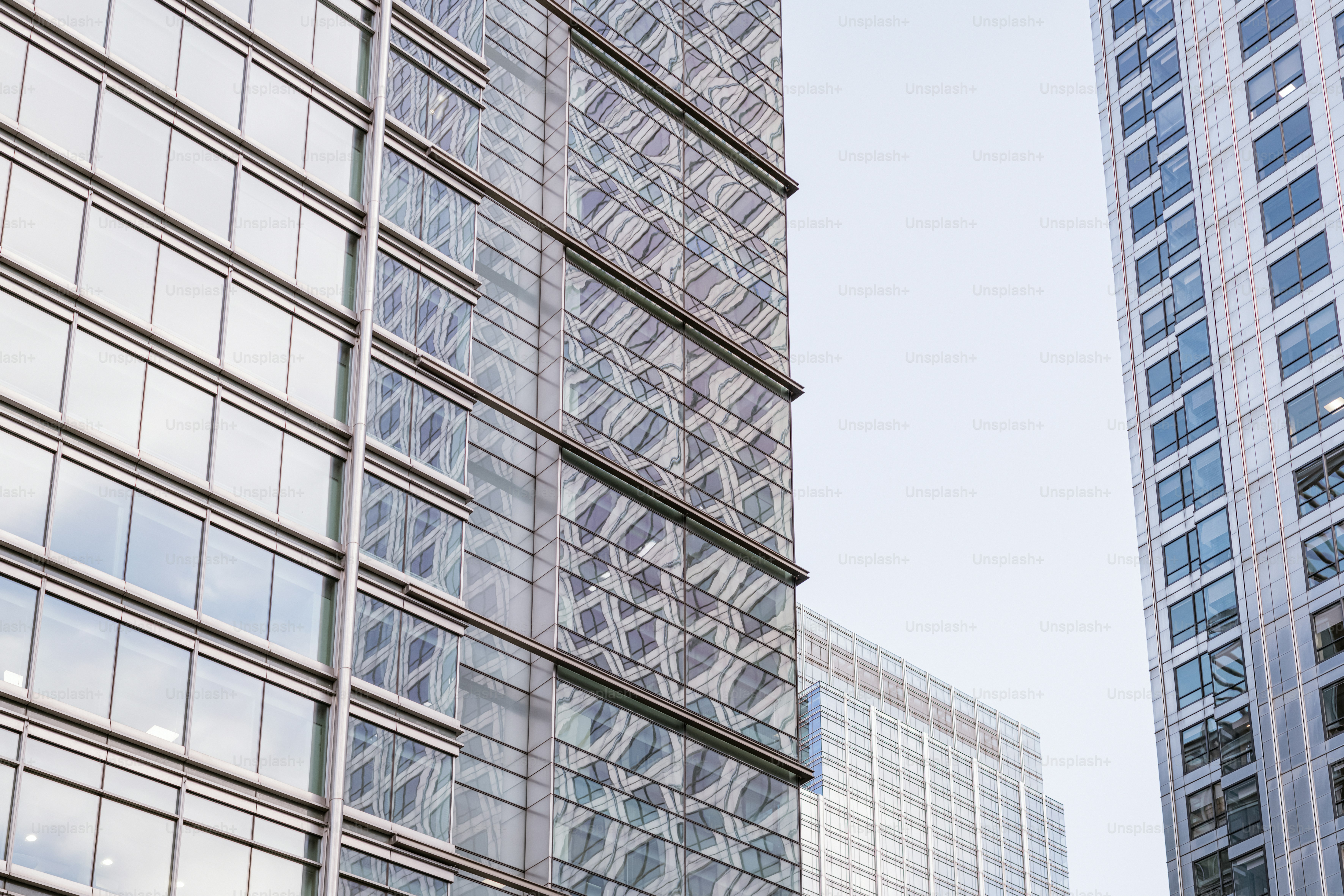 A group of tall buildings sitting next to each other photo – London ...