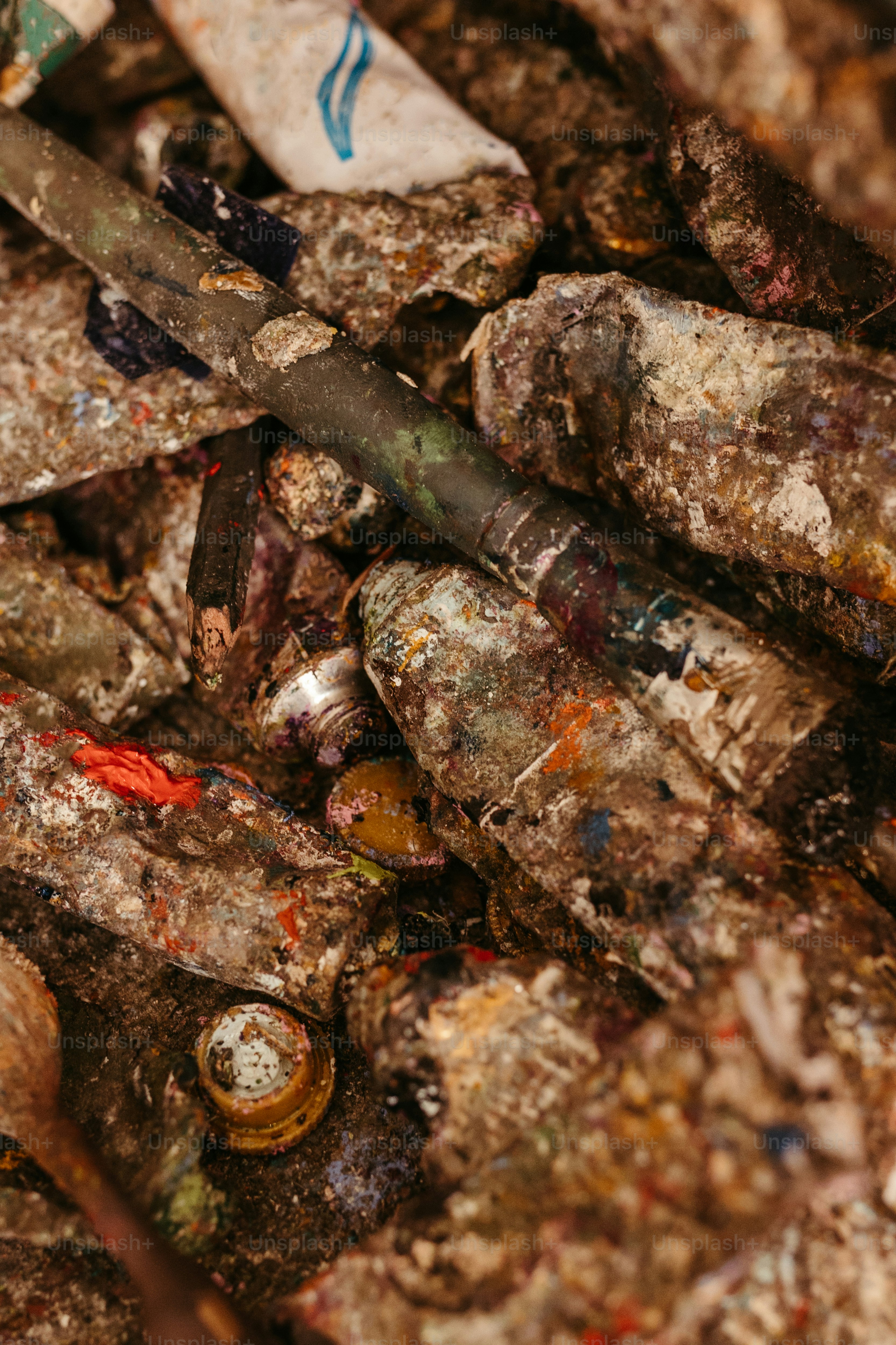 A close up of a bunch of paint and a pair of scissors photo ...