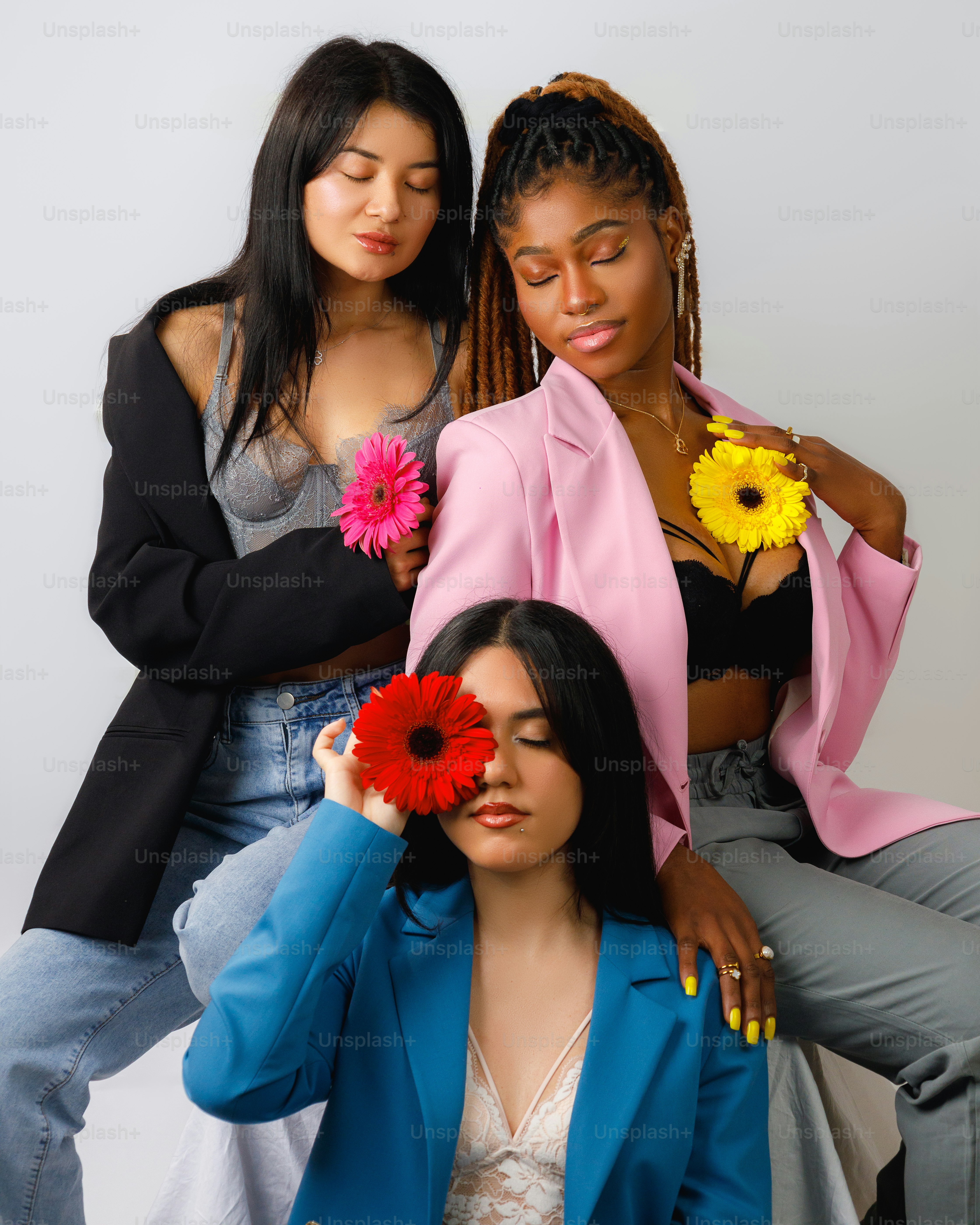 A group of three women standing next to each other photo – Women Image ...