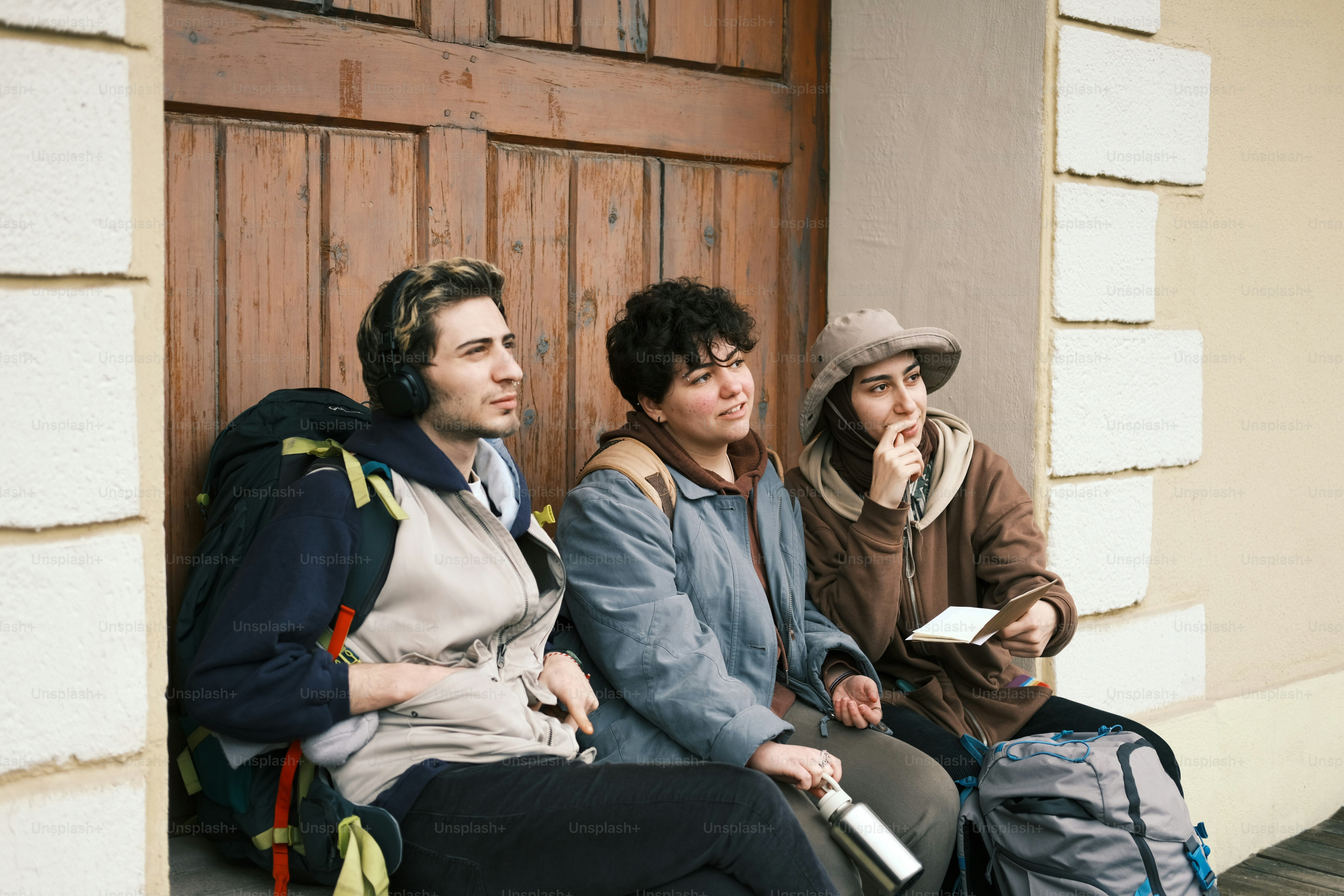 A group of people sitting next to each other photo – Holiday Image on ...