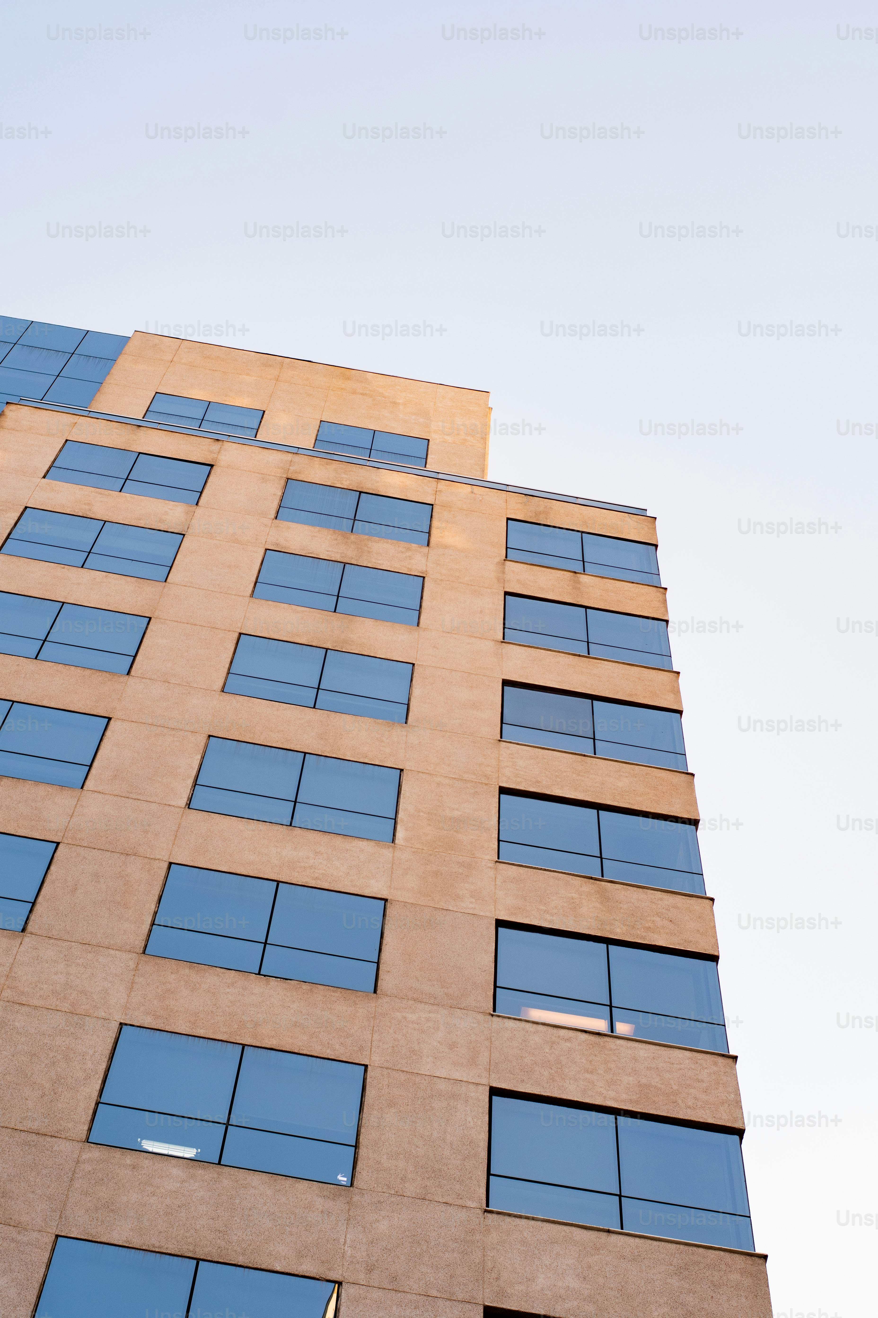 A very tall building with lots of windows photo – Building Image on ...