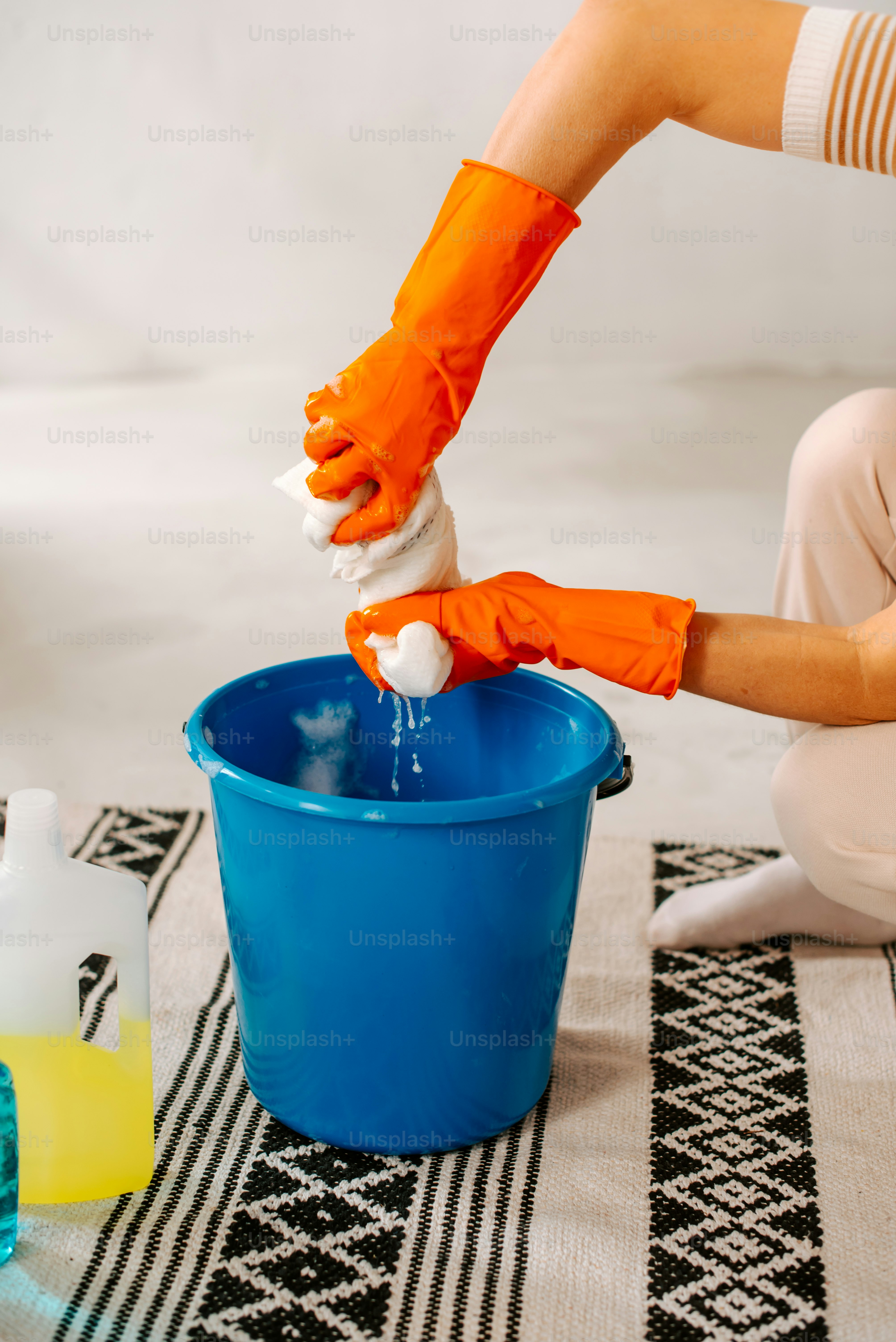 A person is cleaning the floor with a mop photo – Cleaning up Image on ...