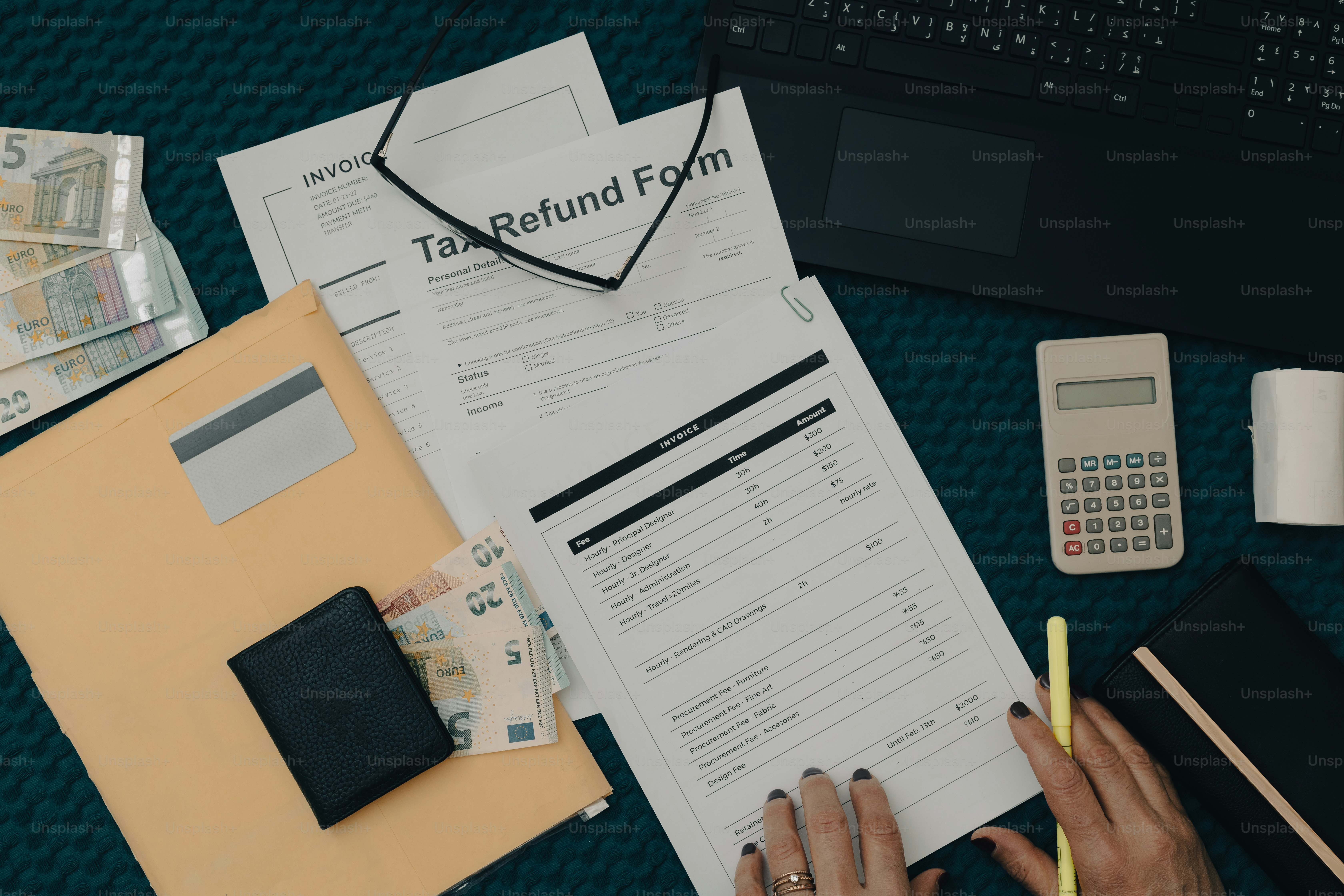 A person is filling out a tax return form photo – Financial Image on ...