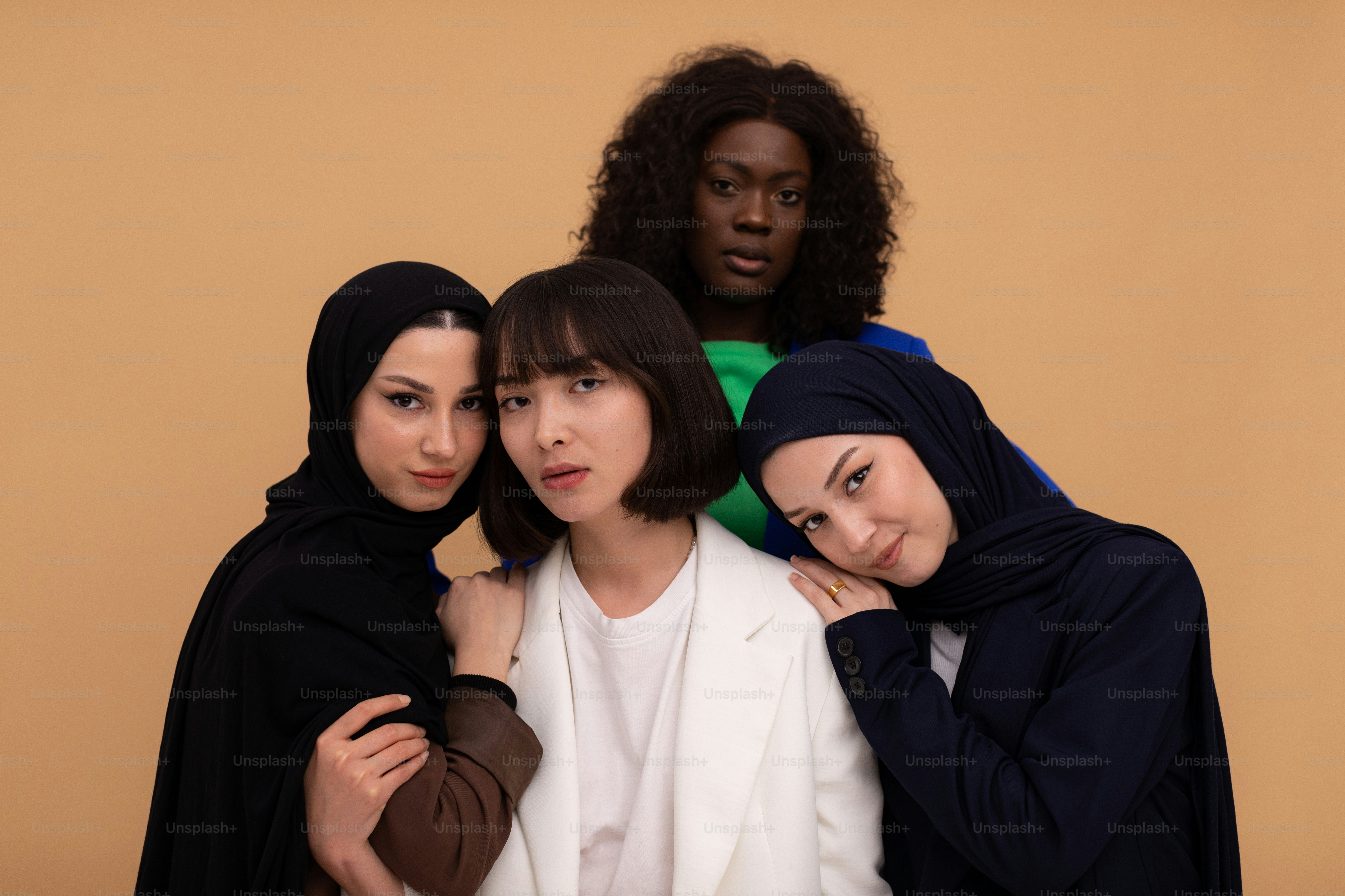 A group of three women standing next to each other photo – Female Image ...