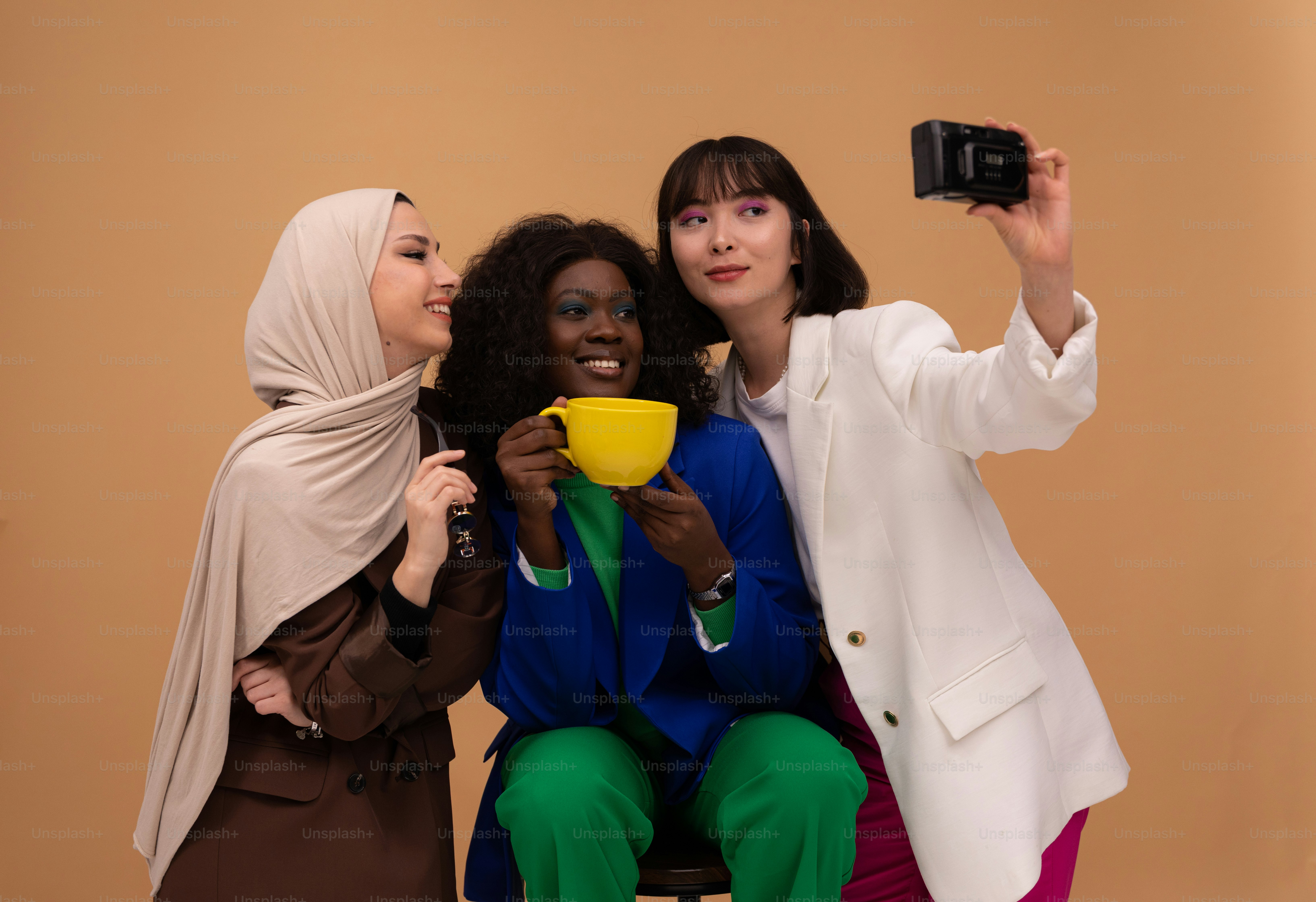 Three women taking a picture with a camera photo – Female Image on Unsplash