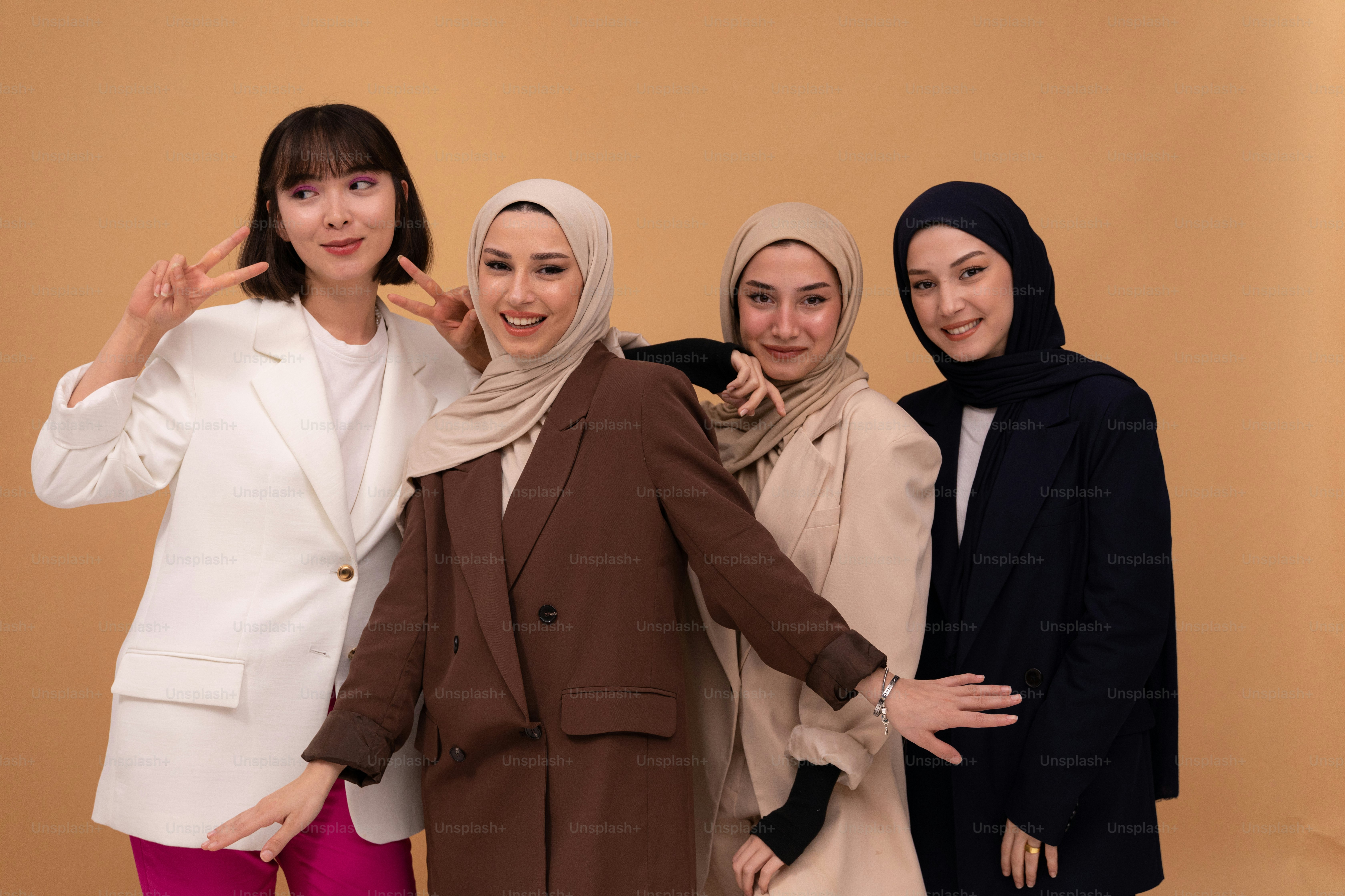 A group of women sitting next to each other photo – Women Image on Unsplash