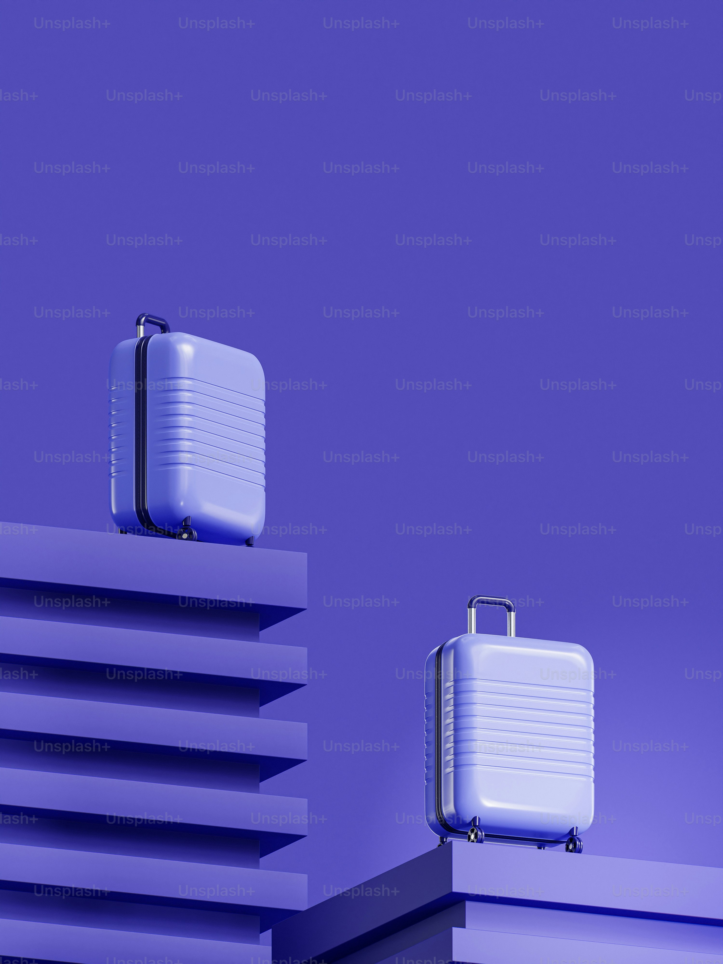 Two pieces of luggage sitting on top of a building photo – Background ...