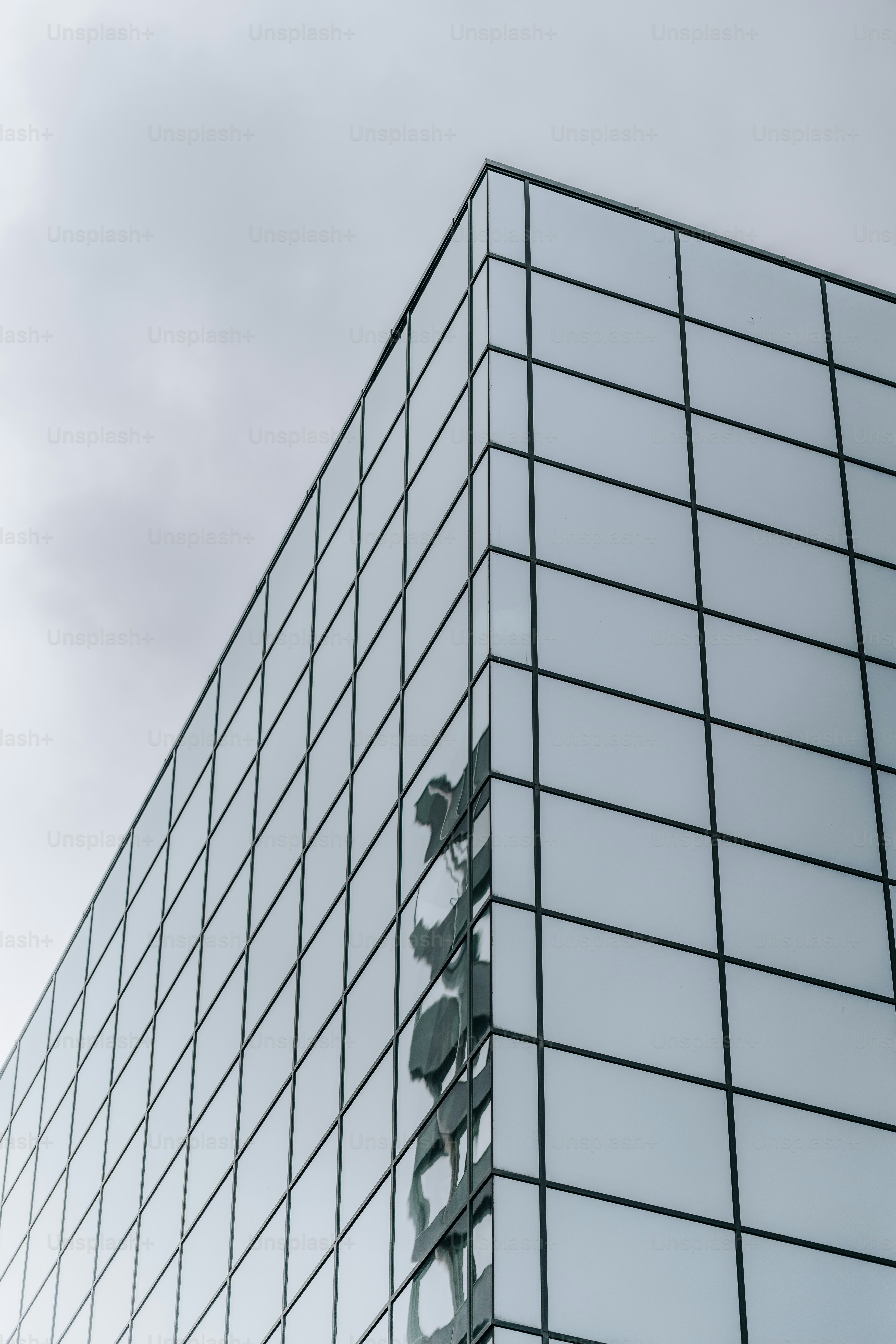 A tall glass building with a sky background photo – Urban Image on Unsplash