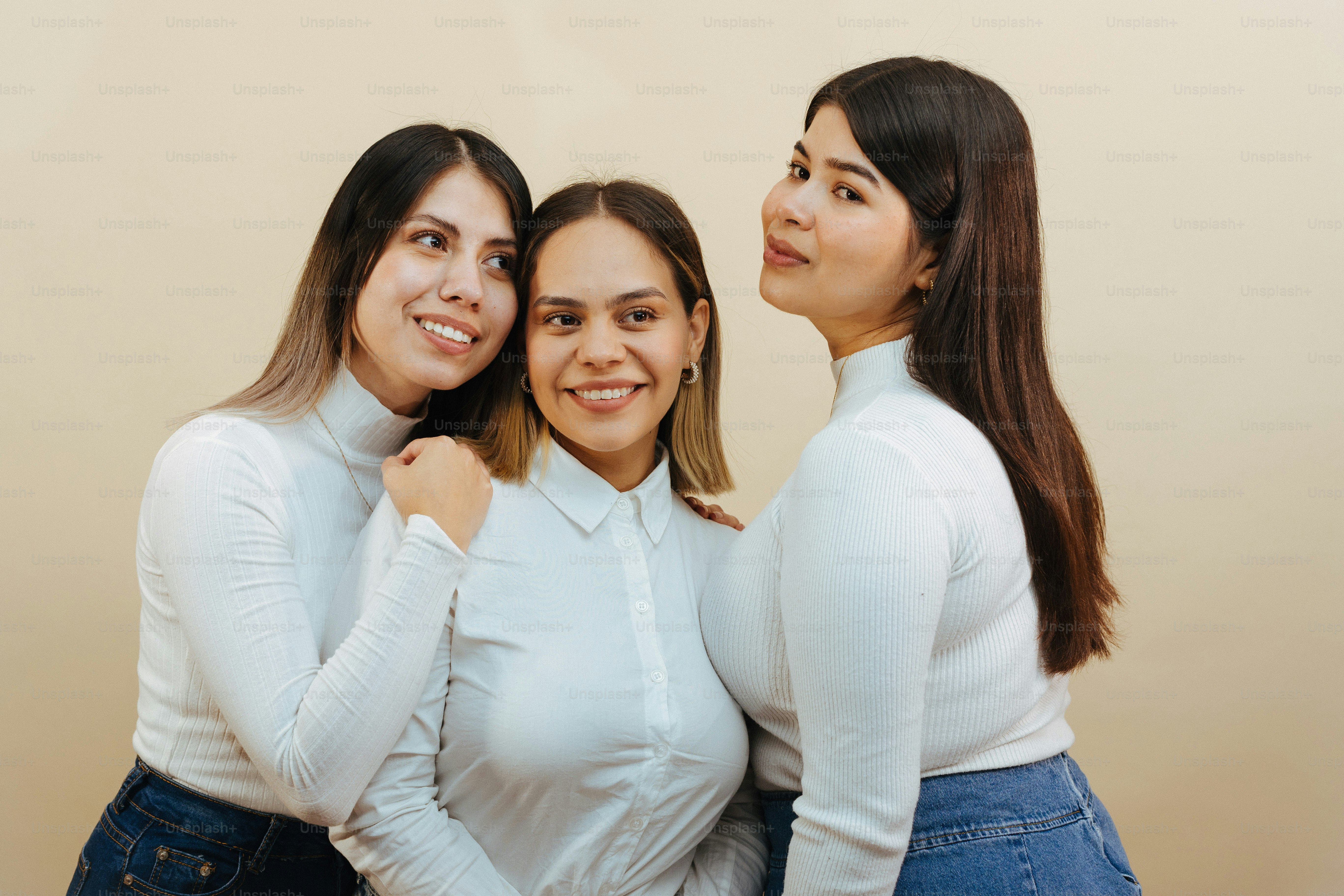 A group of three women standing next to each other photo – Fashion ...