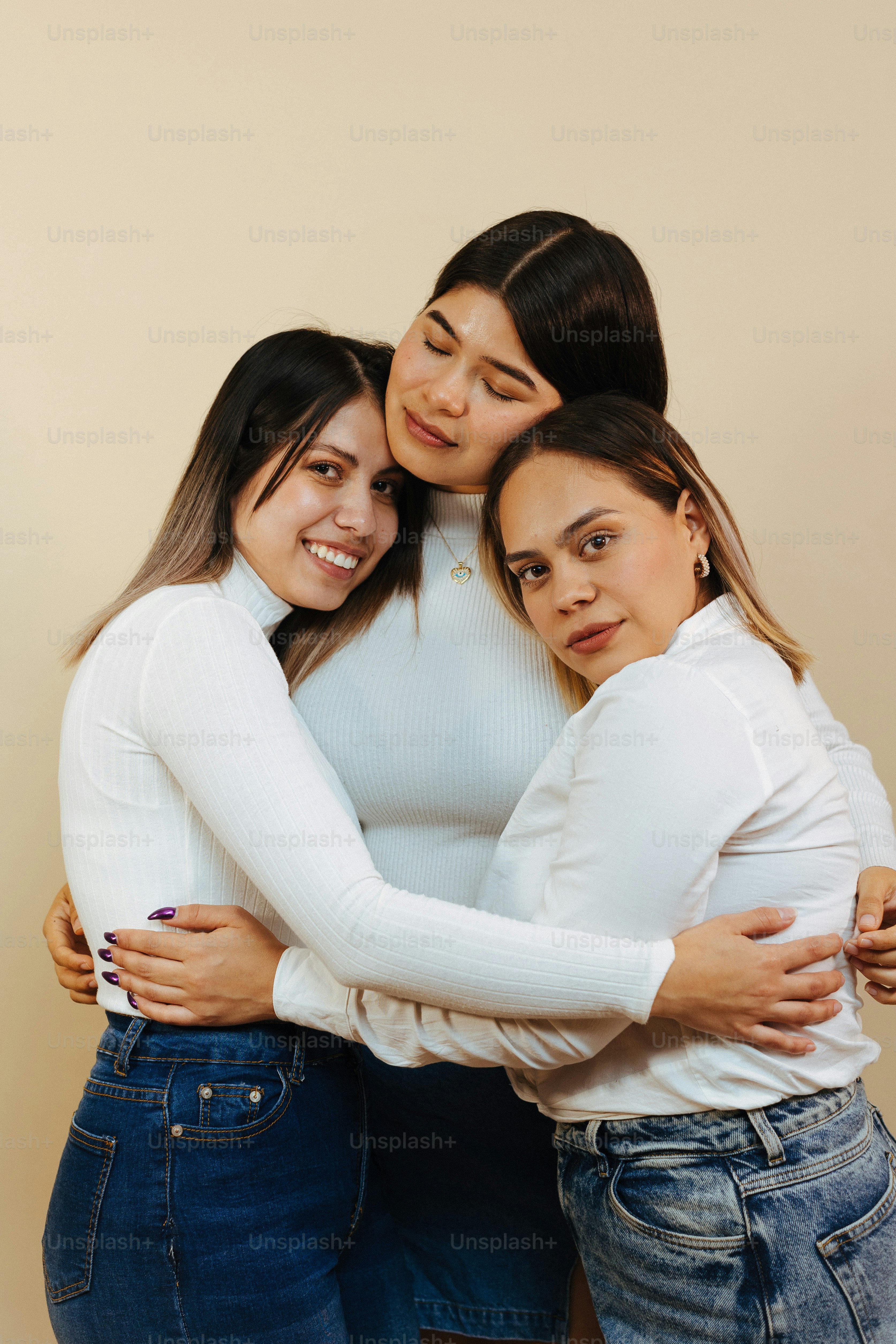 A group of three women hugging each other photo – Bonding Image on Unsplash
