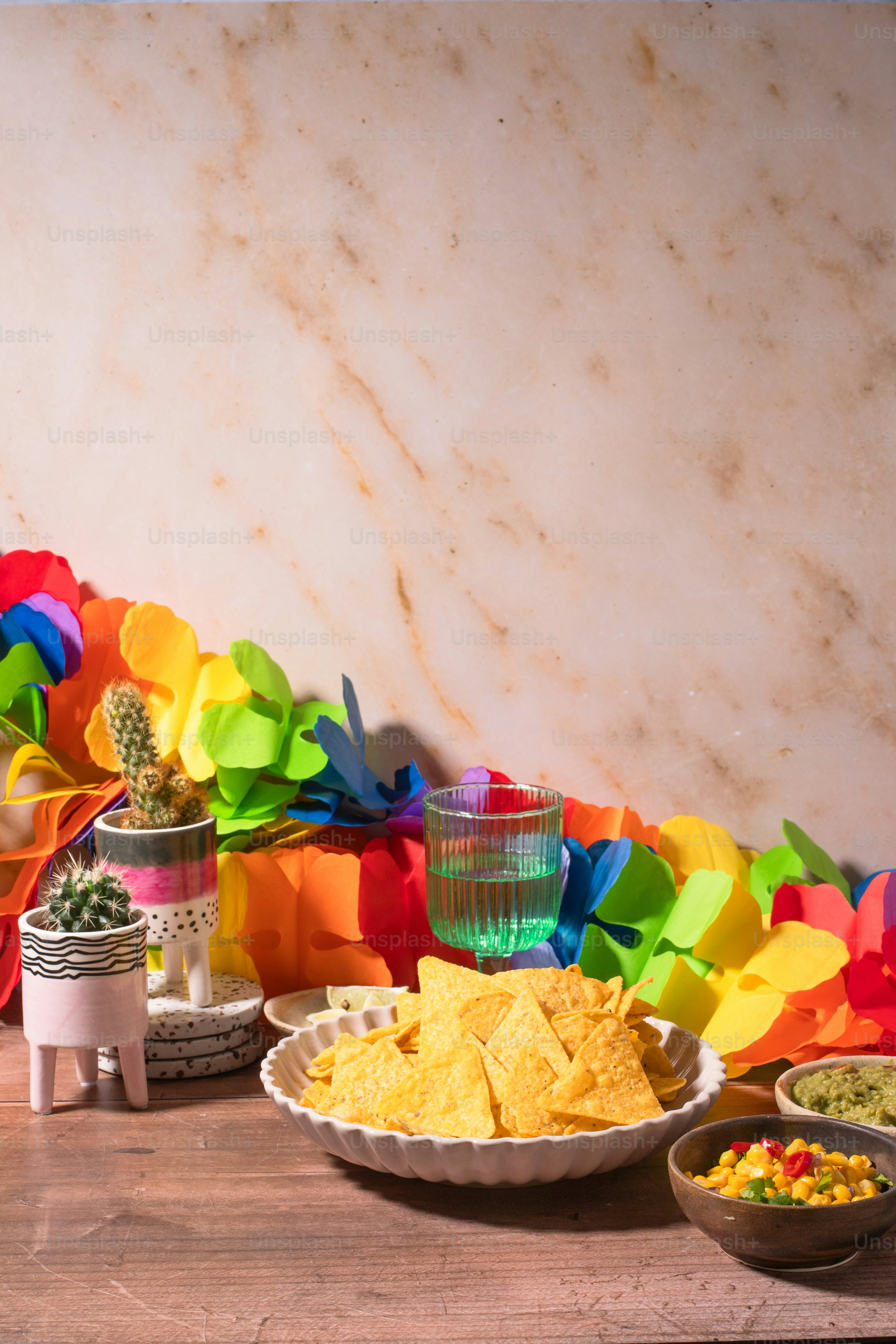 A table topped with plates of food and bowls of salsa photo – Mexico ...