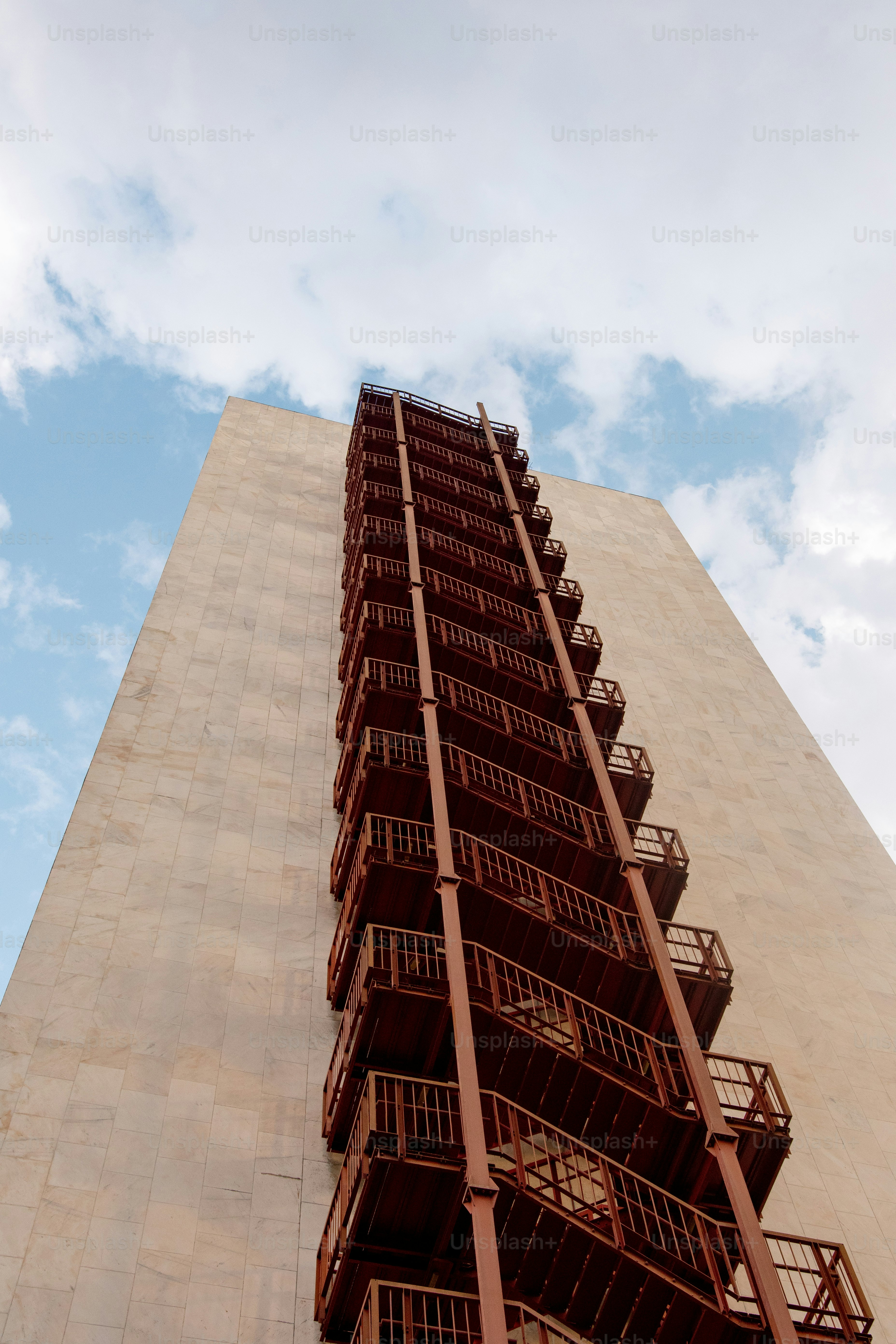 A tall building with a sky background photo – Outside commercial ...