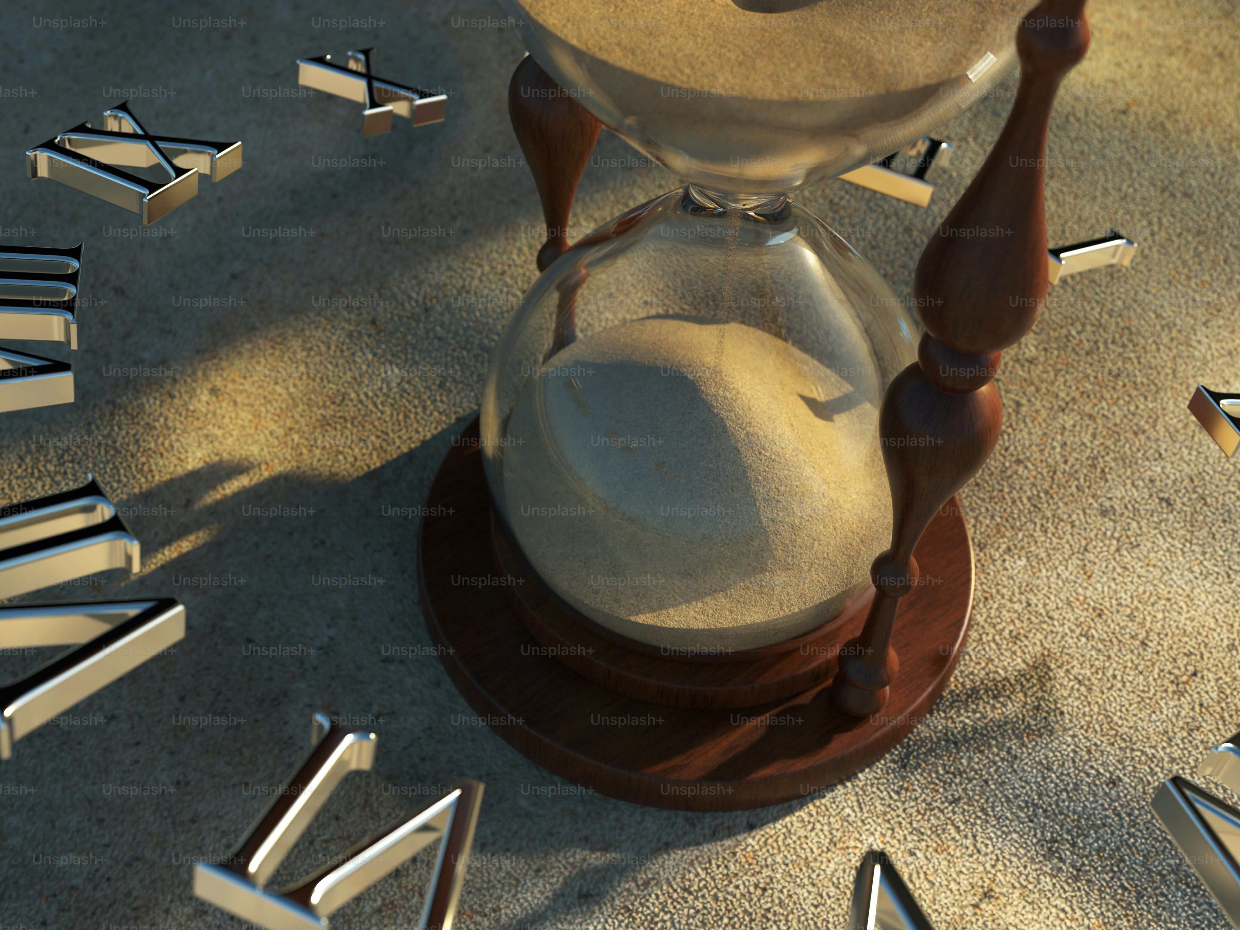 A sand clock sitting on top of a table photo – Time Image on Unsplash