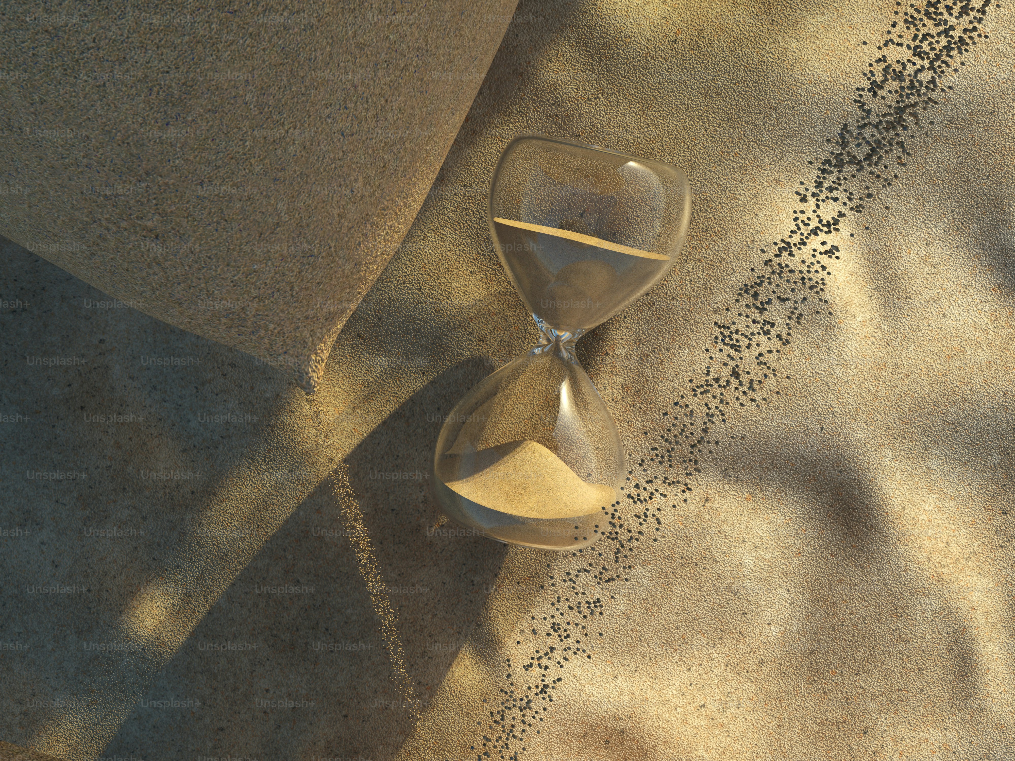 A sand clock sitting on top of a table photo – Time Image on Unsplash