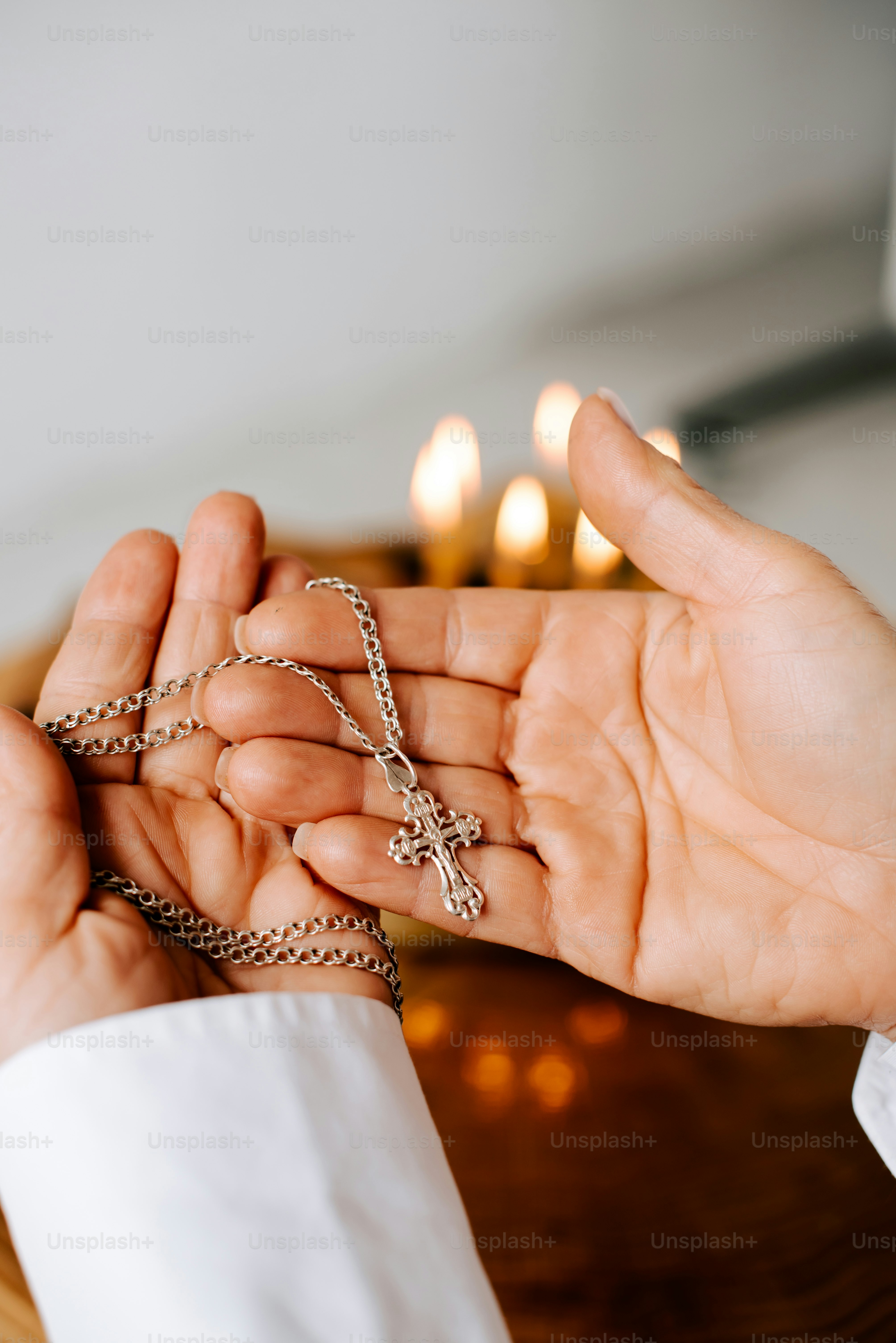 A person holding a rosary in their hands photo – Easter jesus Image on ...