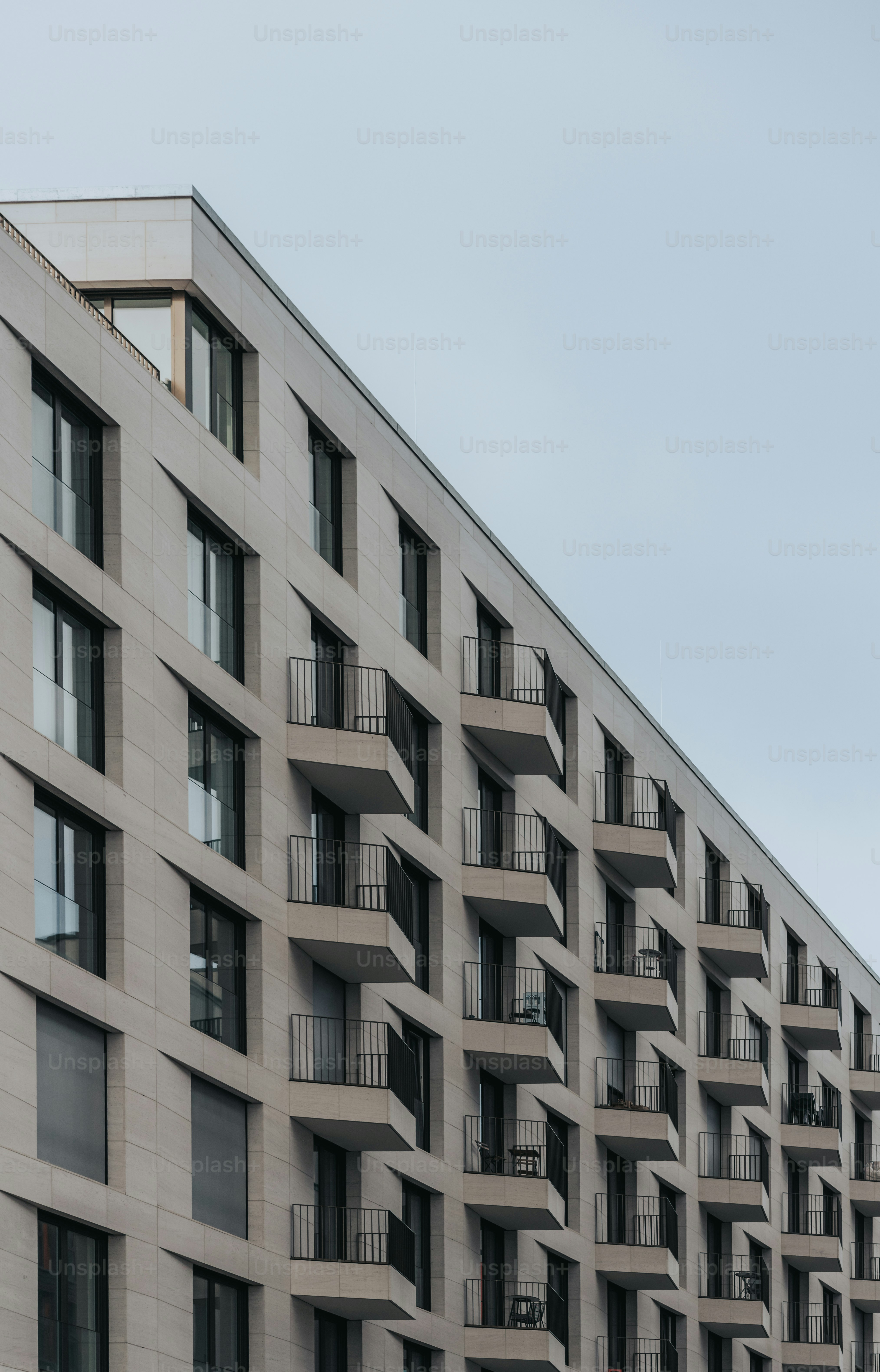 A tall building with lots of windows on top of it photo – Exterior ...