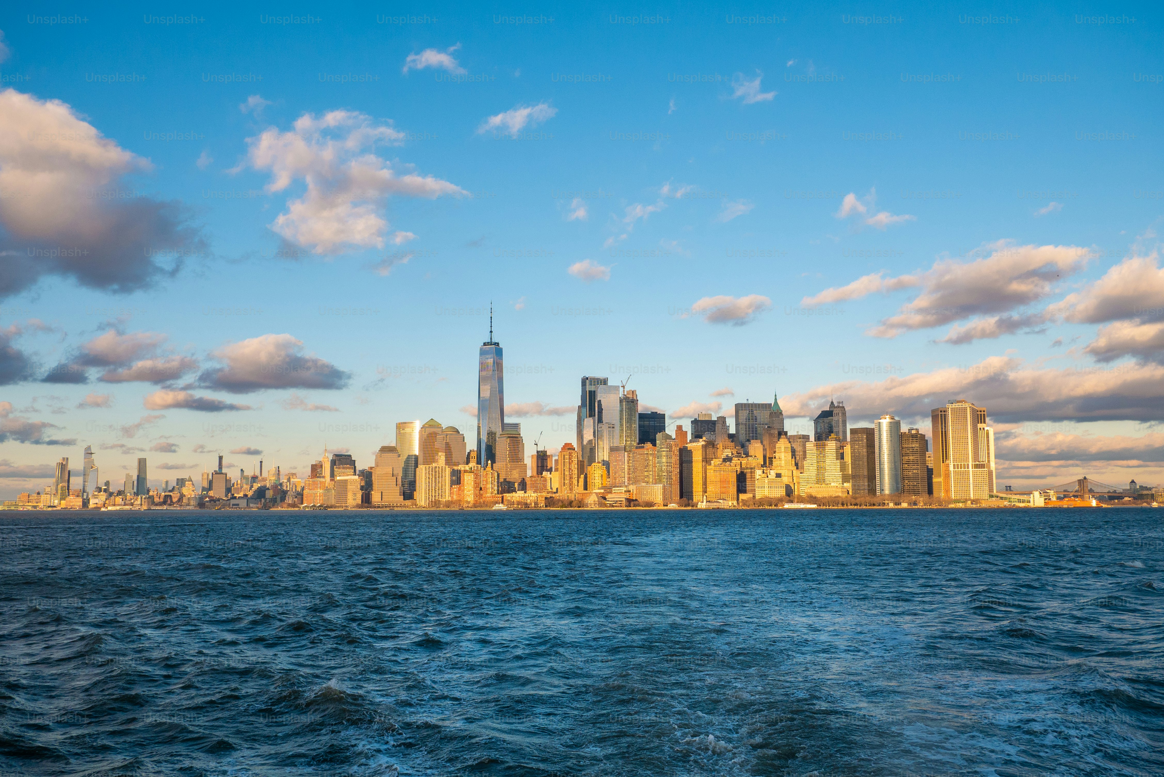A view of a city from the water photo – Waterfront Image on Unsplash