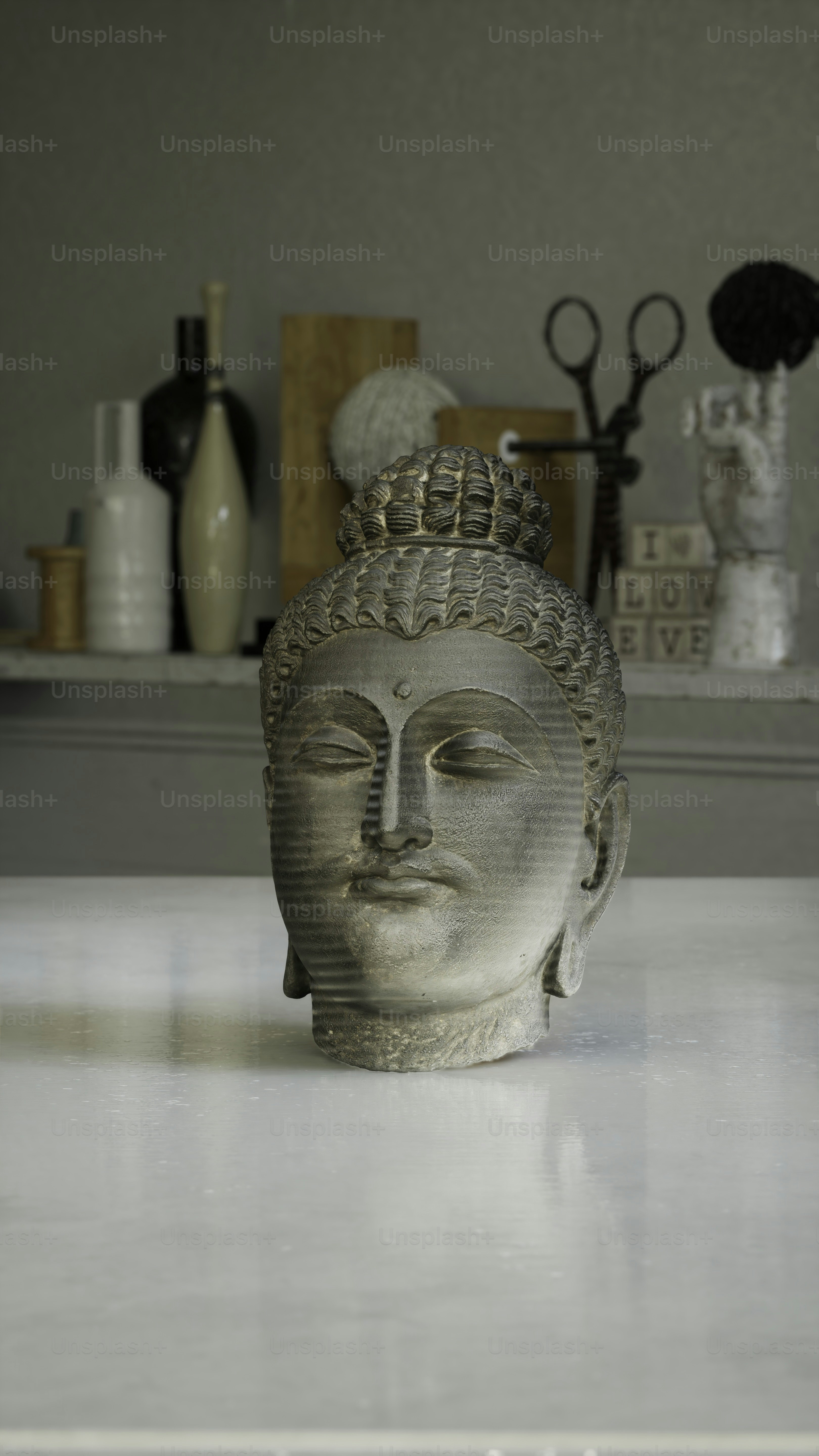 A buddha statue sitting on top of a white counter photo – Buddha Image ...