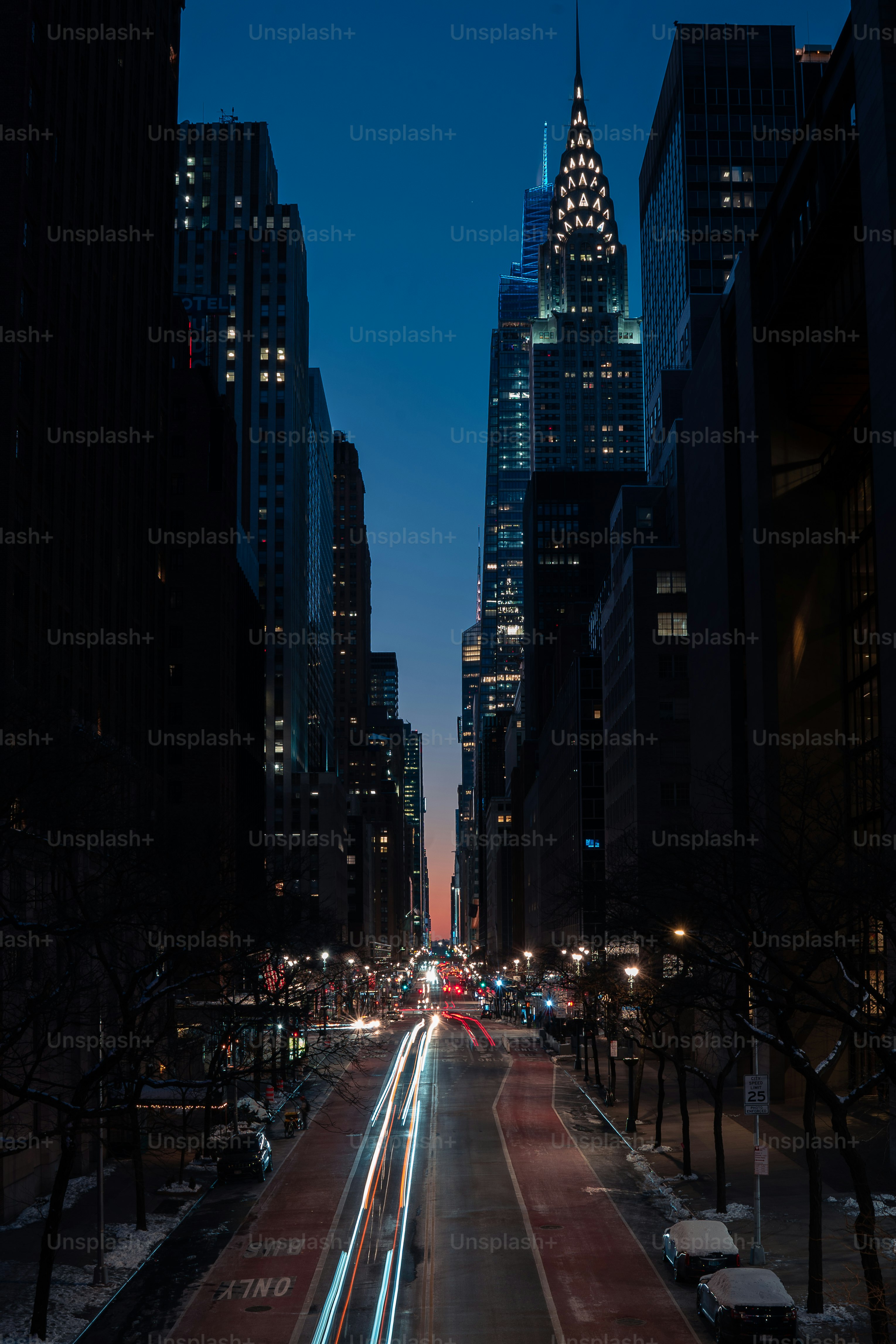 A city street filled with lots of traffic at night photo – Road Image ...