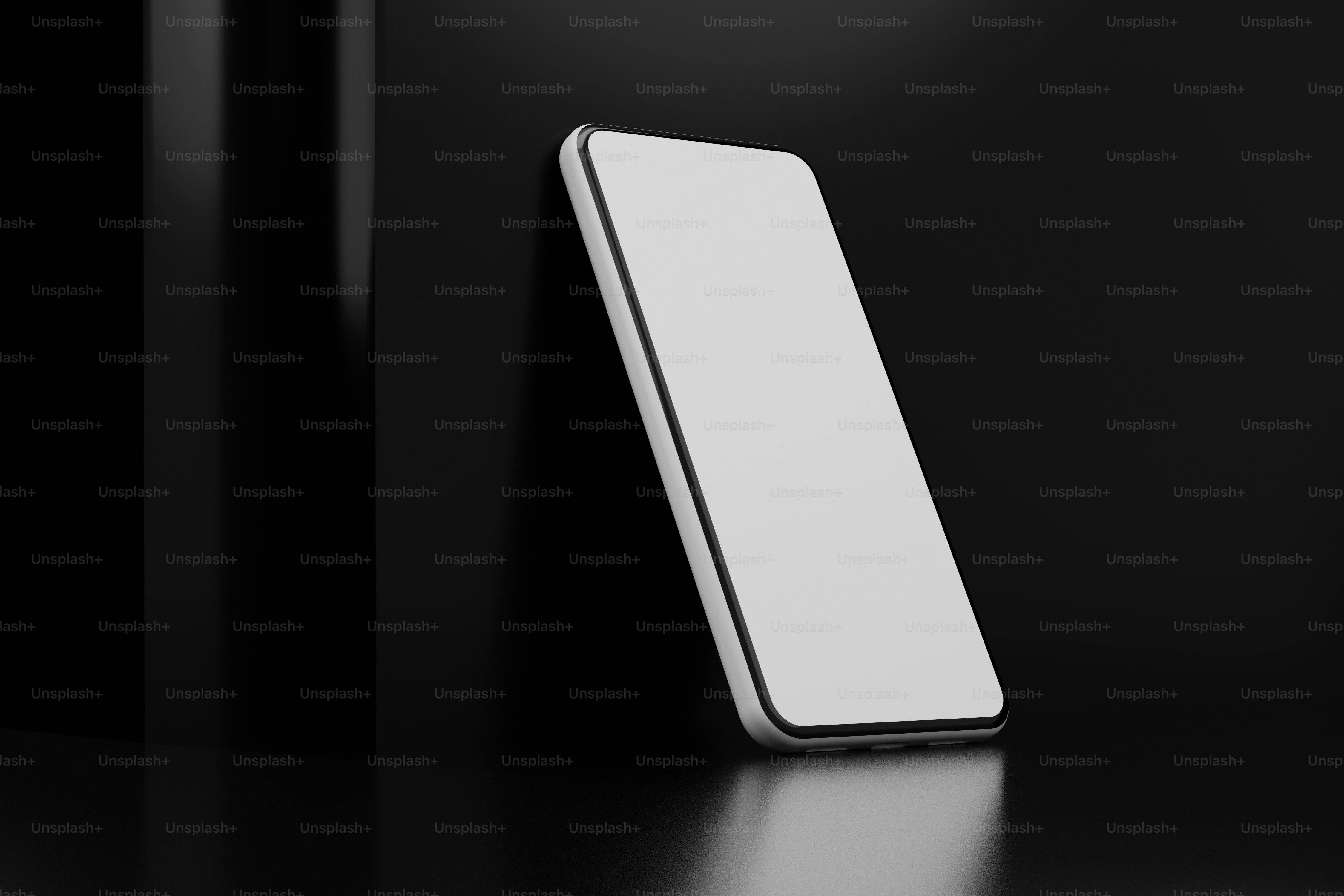 A white and black cell phone sitting on top of a wooden table photo ...