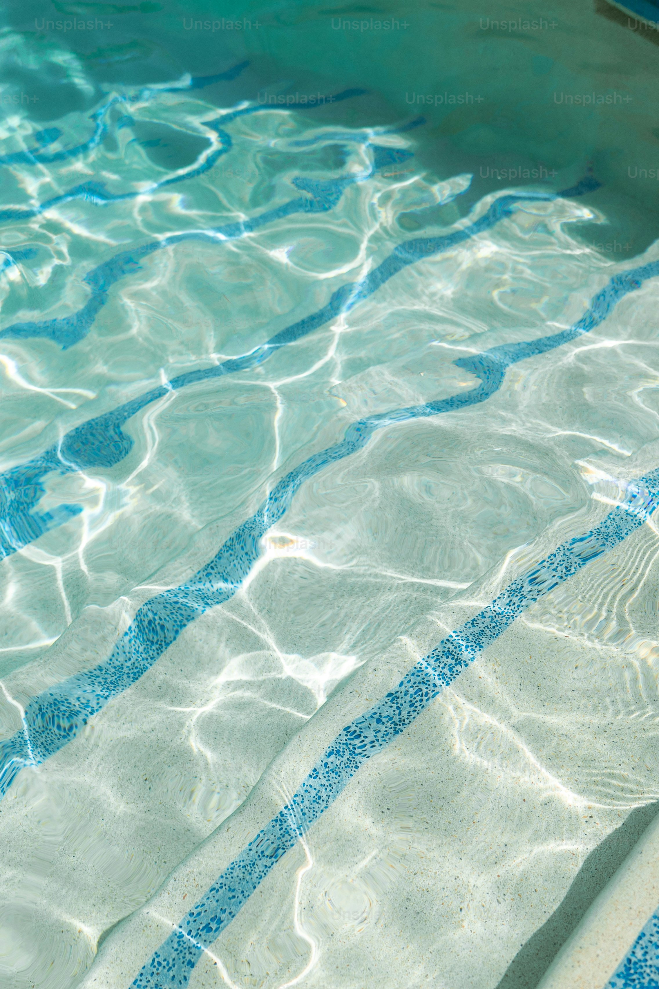 A close up of a swimming pool with clear water photo – Wallpaper Image ...