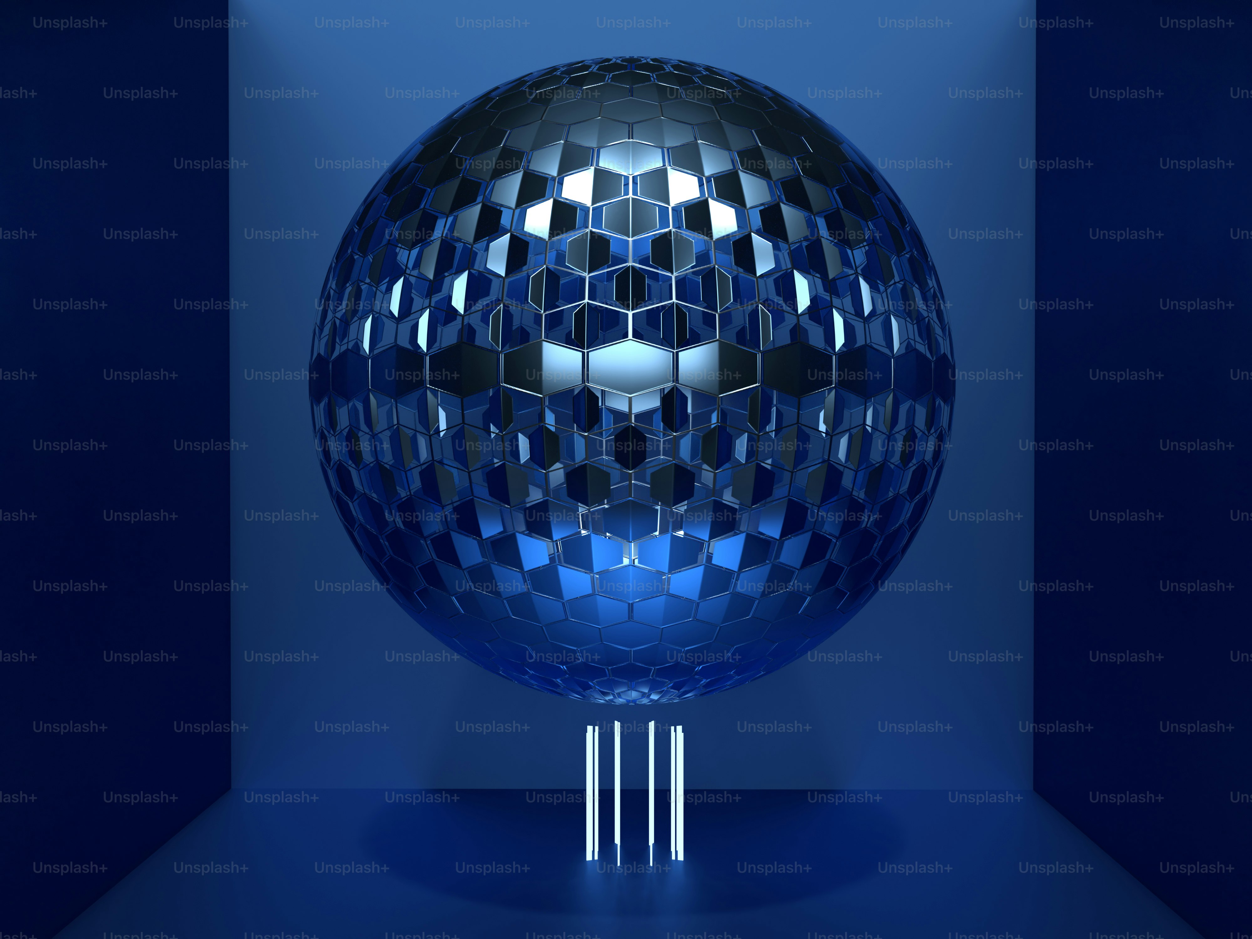 A shiny blue ball on a stand in a dark room photo – 3d Image on Unsplash
