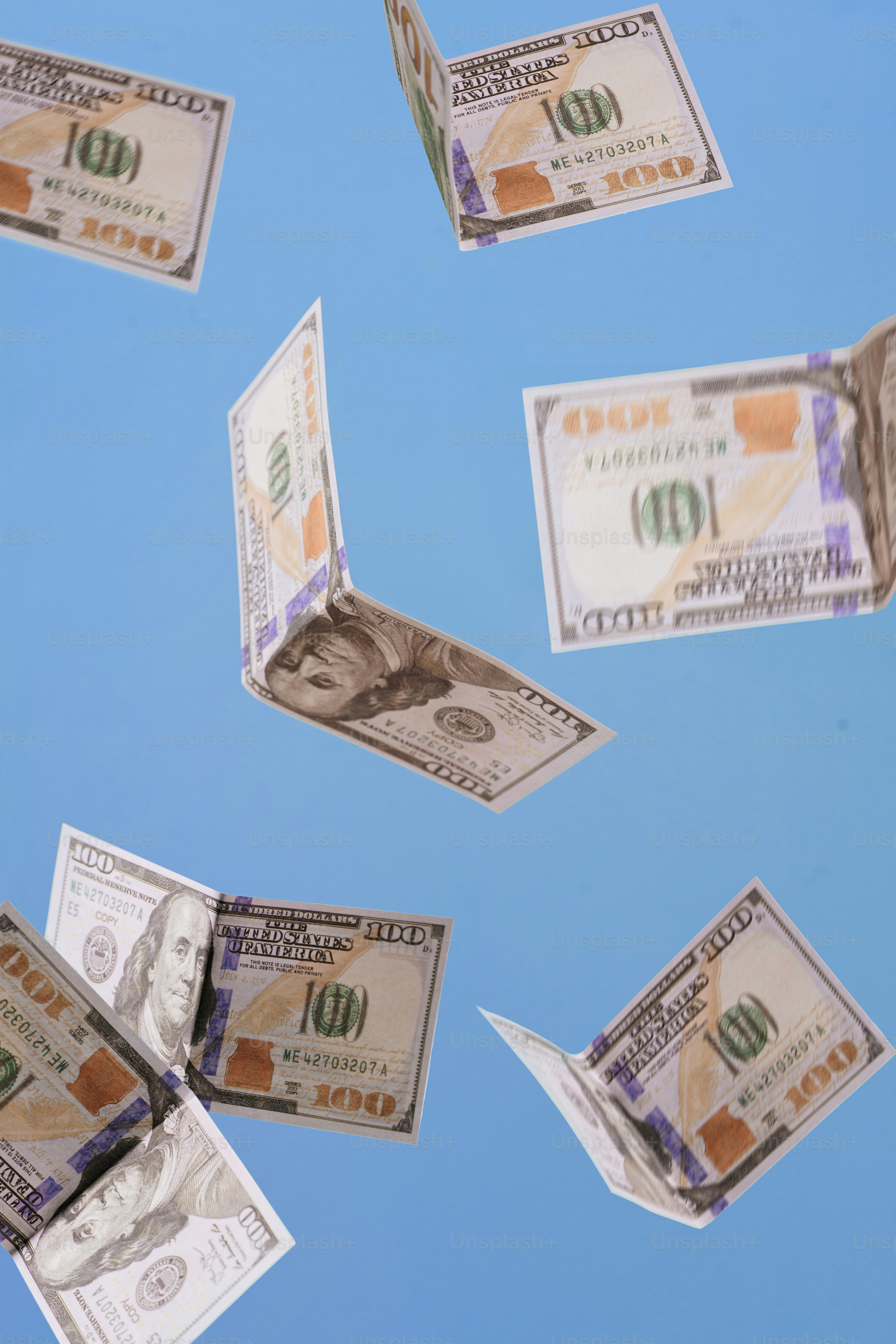 A bunch of money floating in the air photo – Rich Image on Unsplash