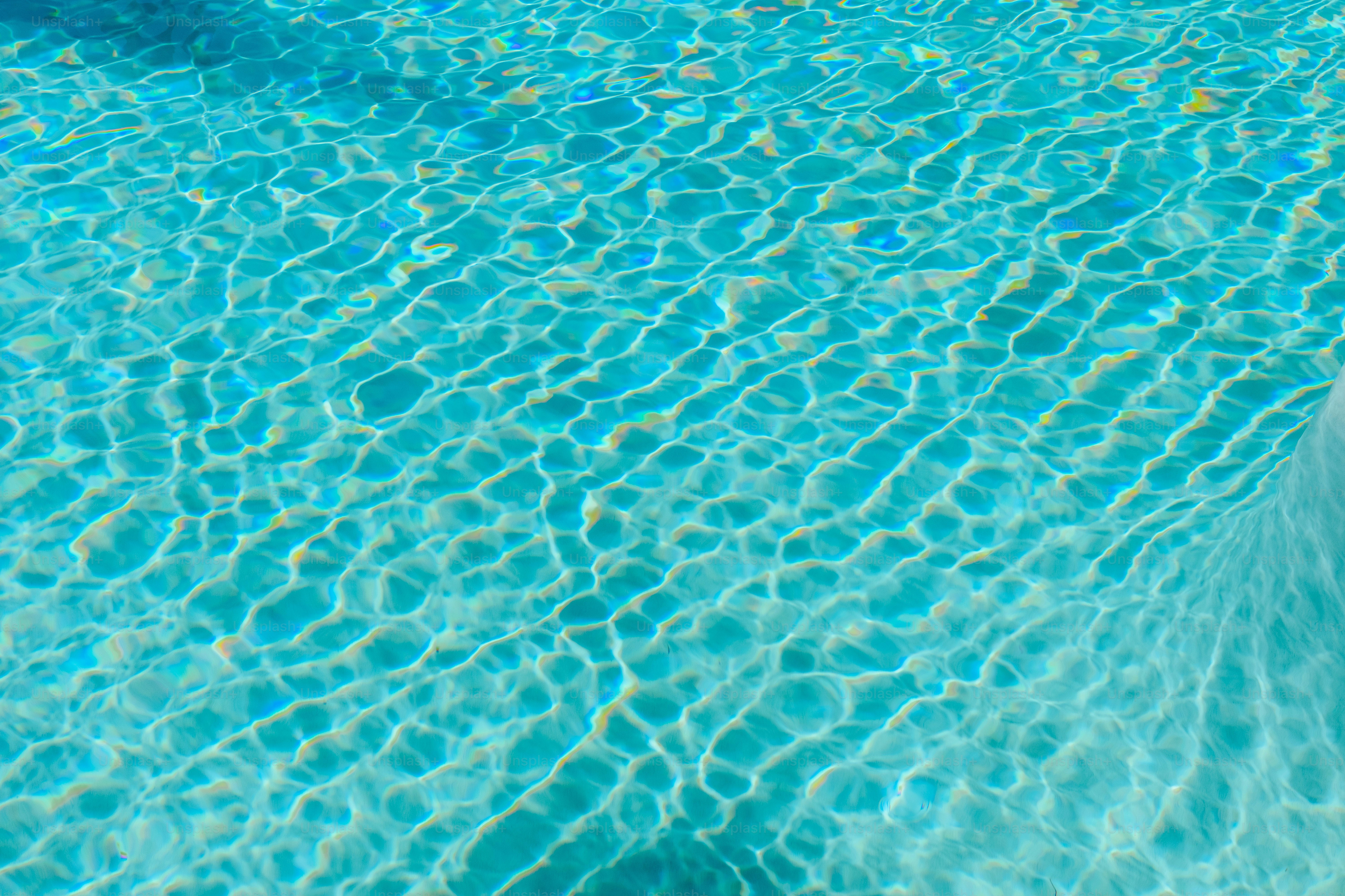 A swimming pool with clear blue water photo – Summer Image on Unsplash