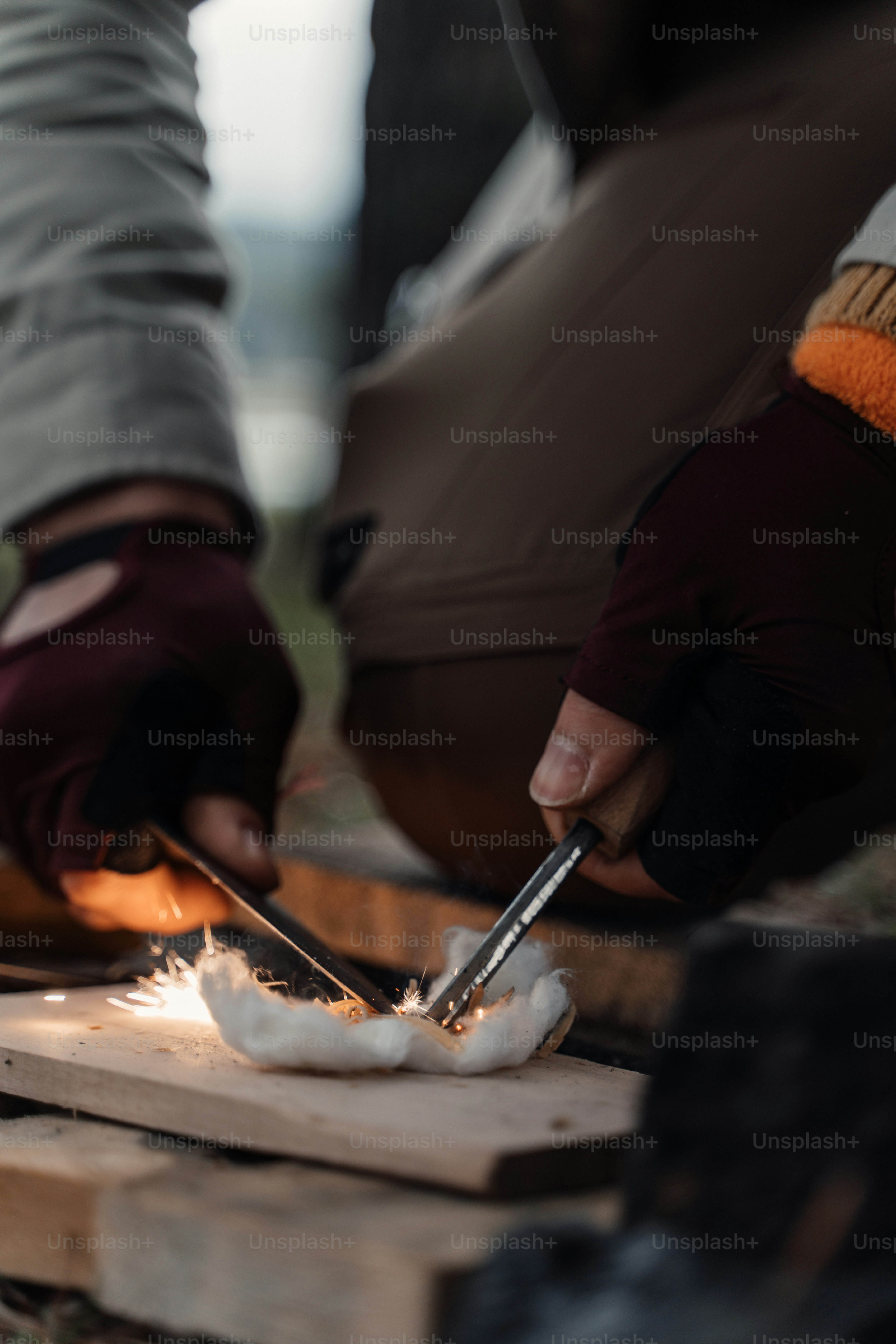 A person cutting something with a knife on a cutting board photo ...