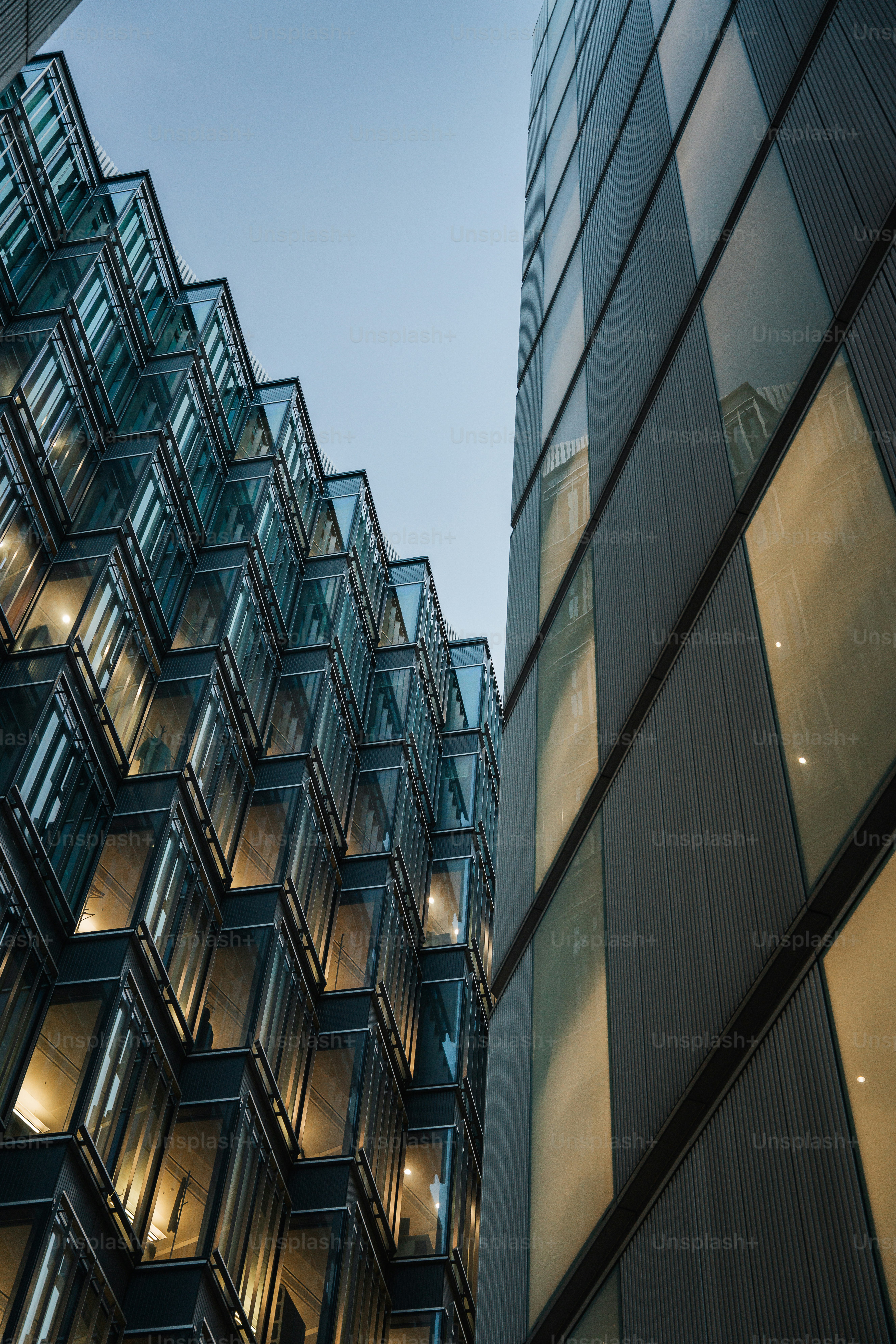 A very tall building sitting next to other tall buildings photo ...