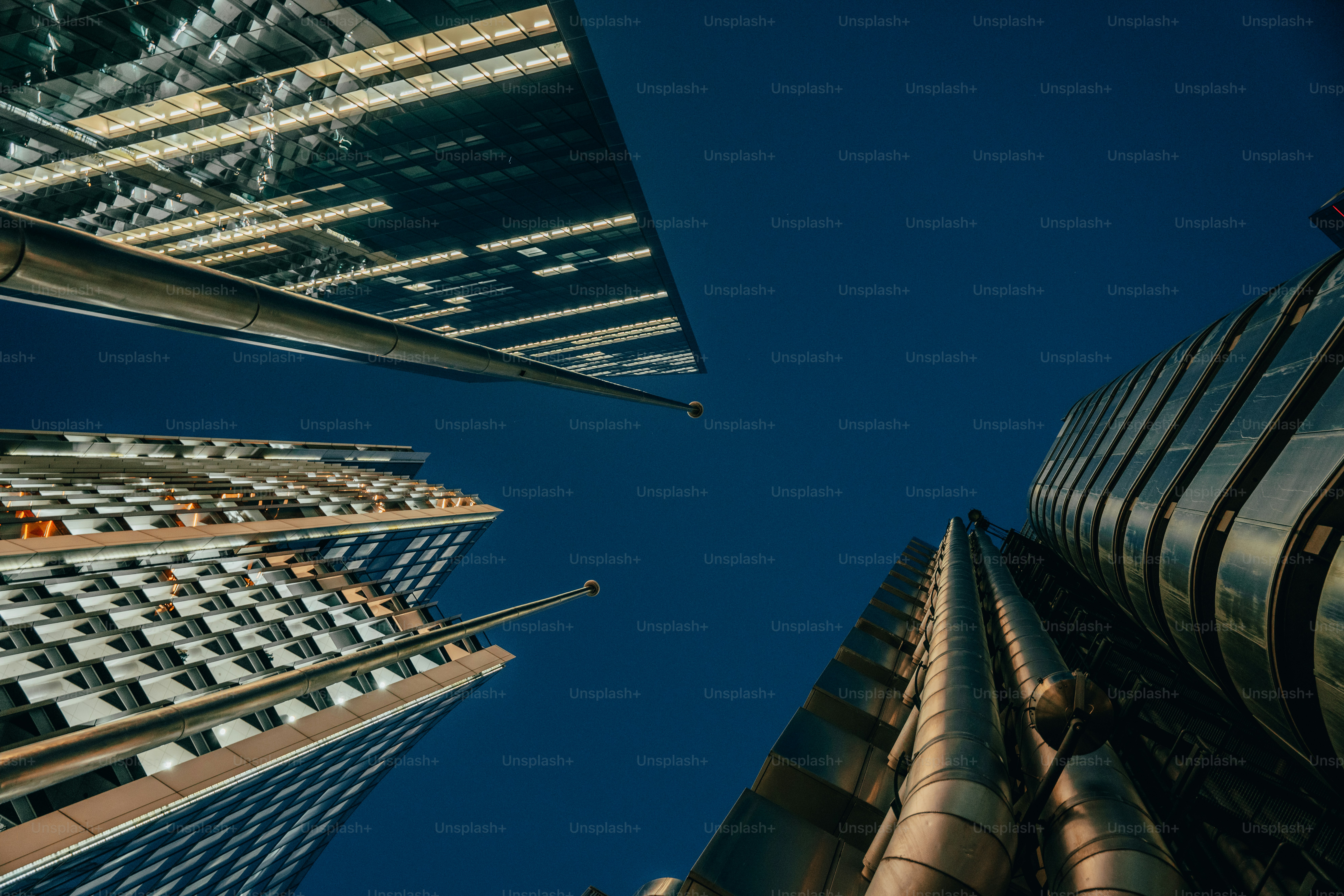 Looking up at tall buildings in a city photo – City Image on Unsplash