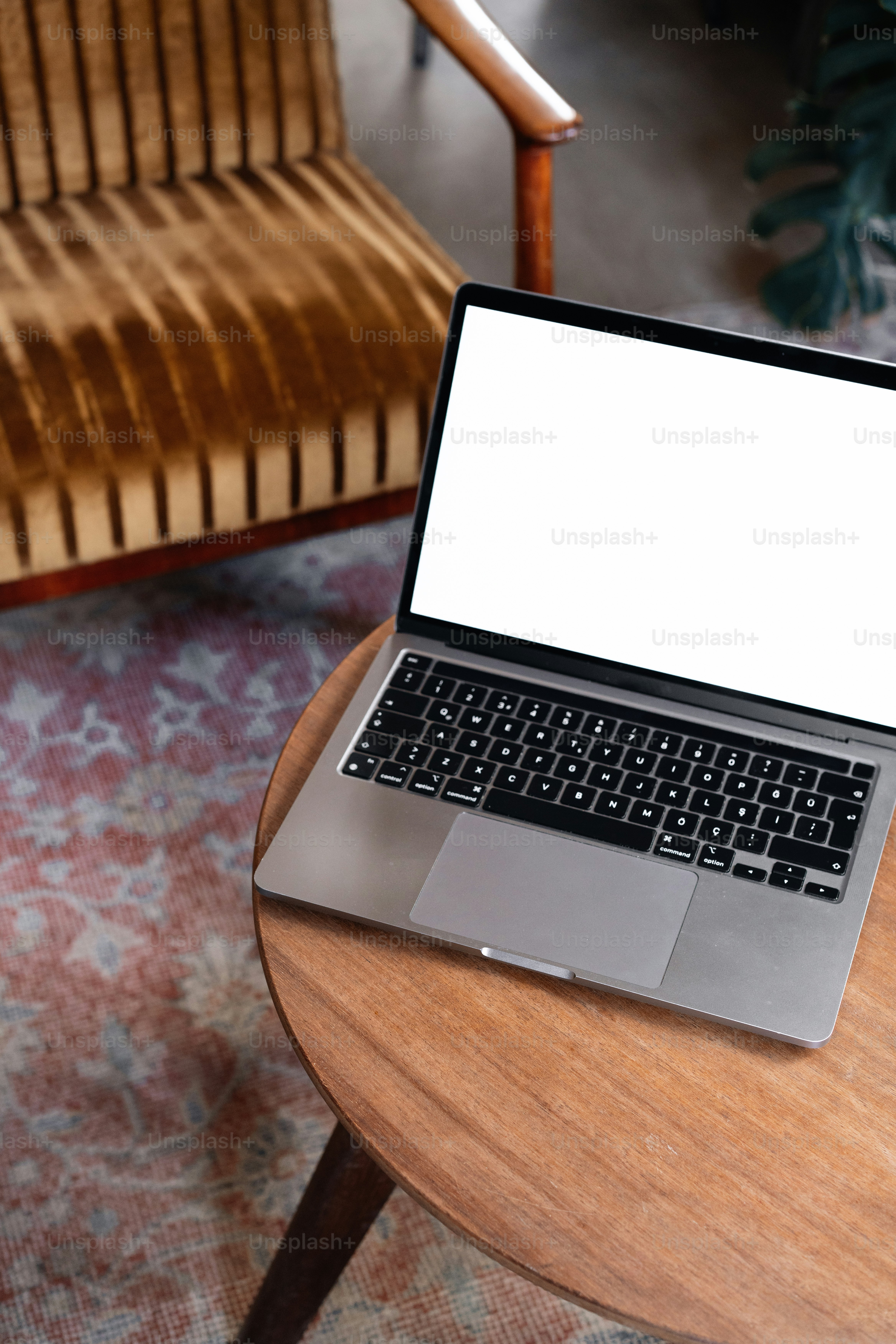 A laptop computer sitting on top of a wooden table photo – Website ...