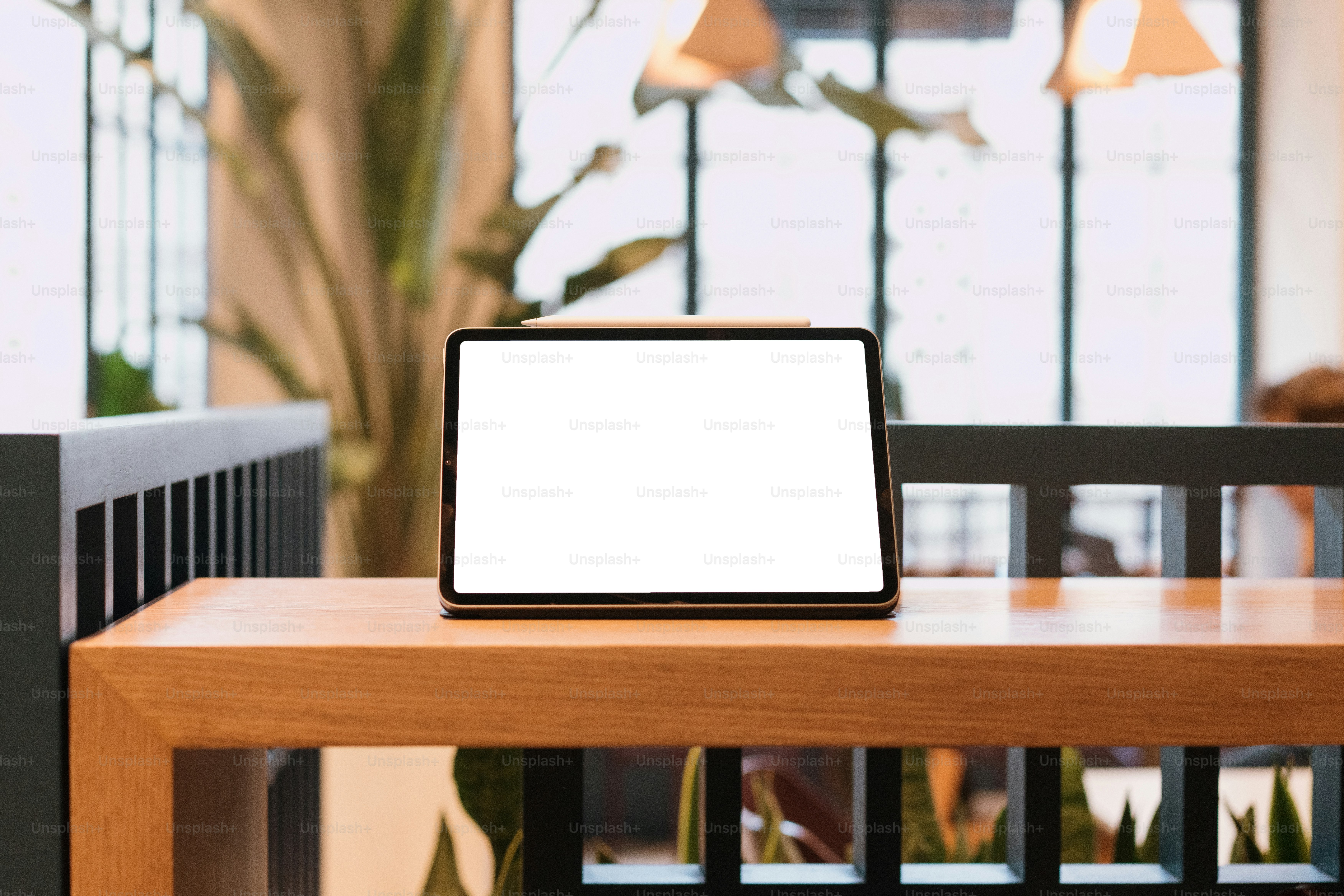 A laptop computer sitting on top of a wooden table photo – Website ...