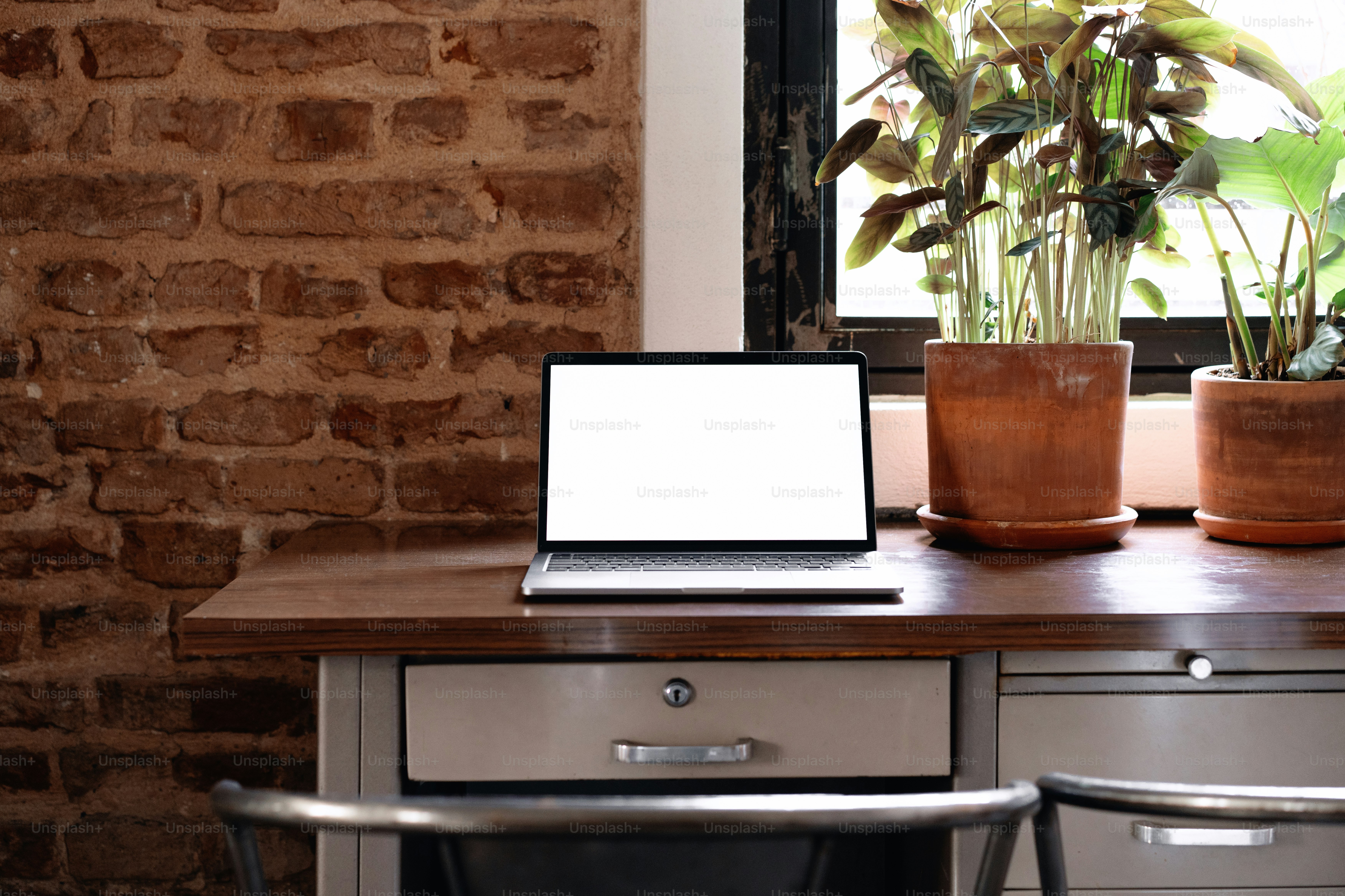 A laptop computer sitting on top of a wooden table photo – Laptop Image ...