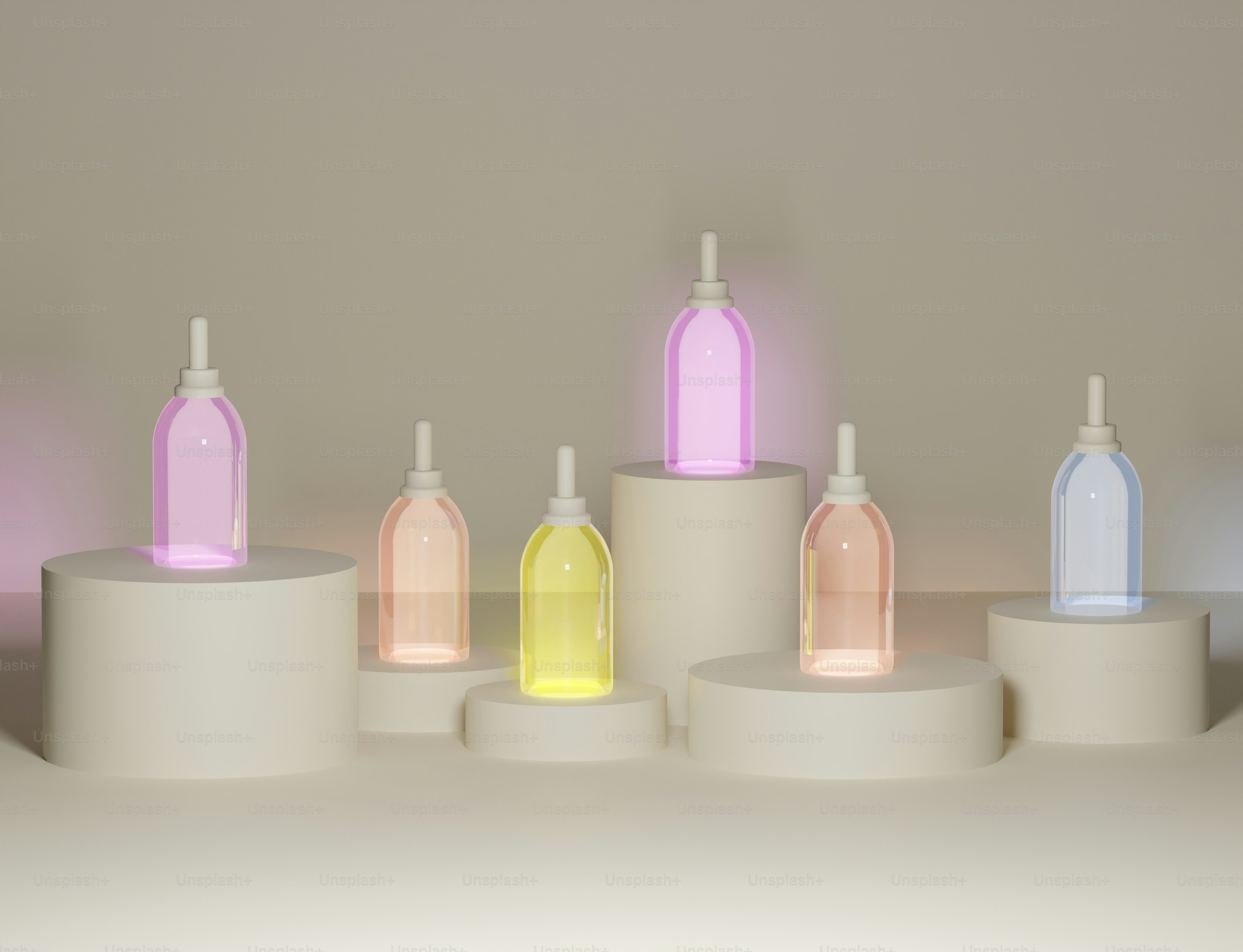 A group of different colored bottles sitting on top of each other photo ...
