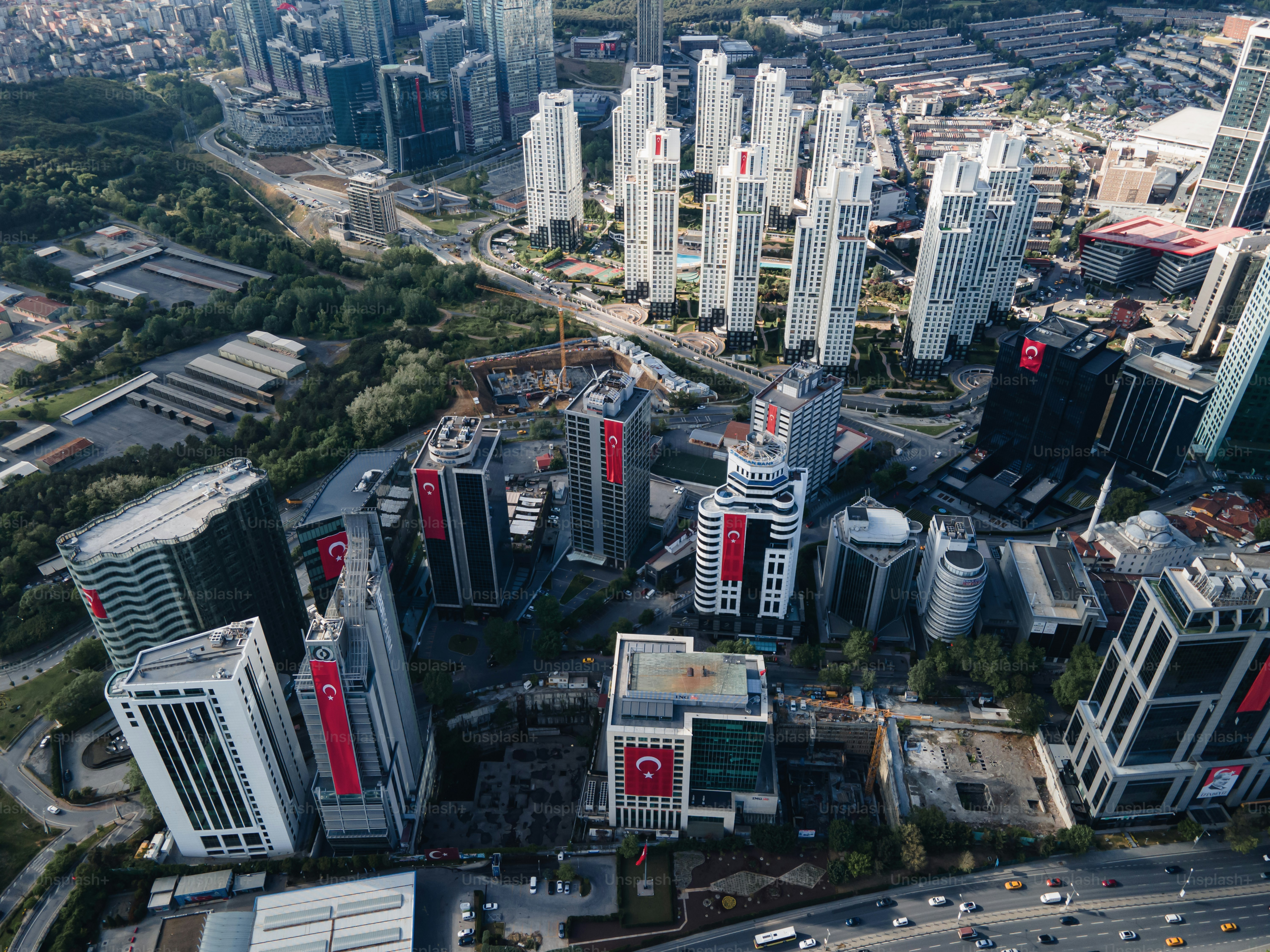 An aerial view of a city with tall buildings photo – 3d render Image on ...
