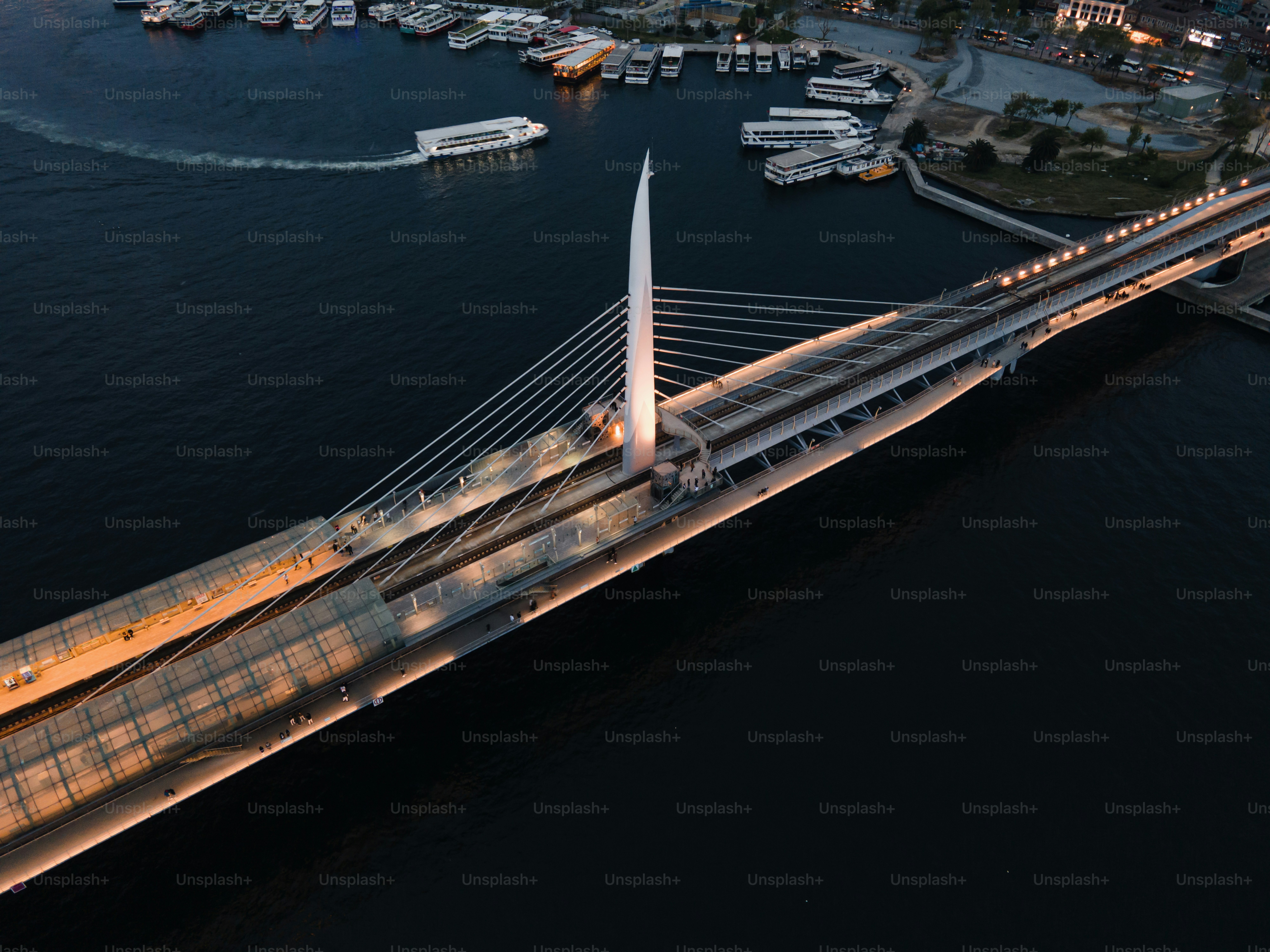 An aerial view of a bridge over a body of water photo – Bridge Image on ...